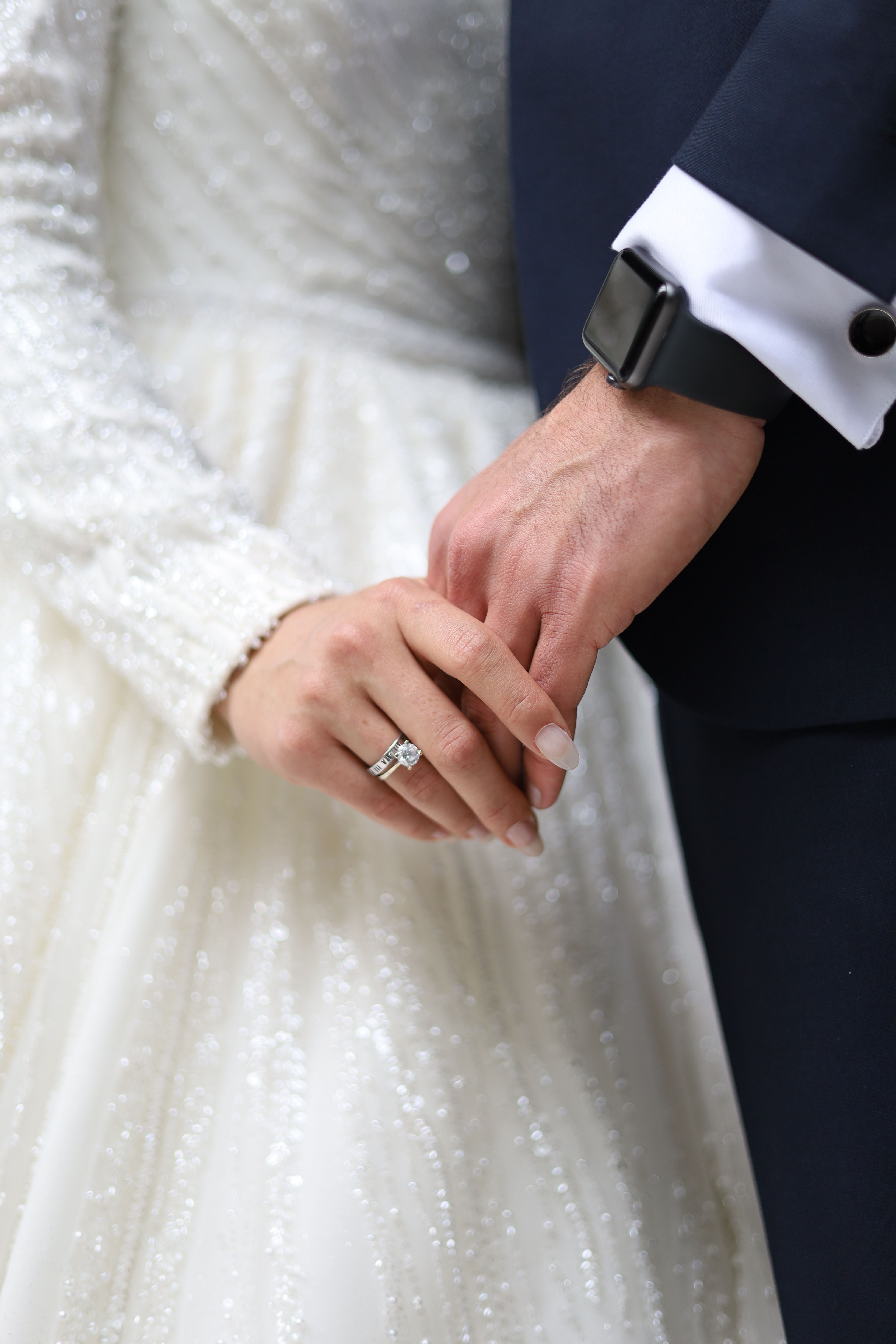 Elegant Wedding Couple Holding Hands Close-up · Free Stock Photo