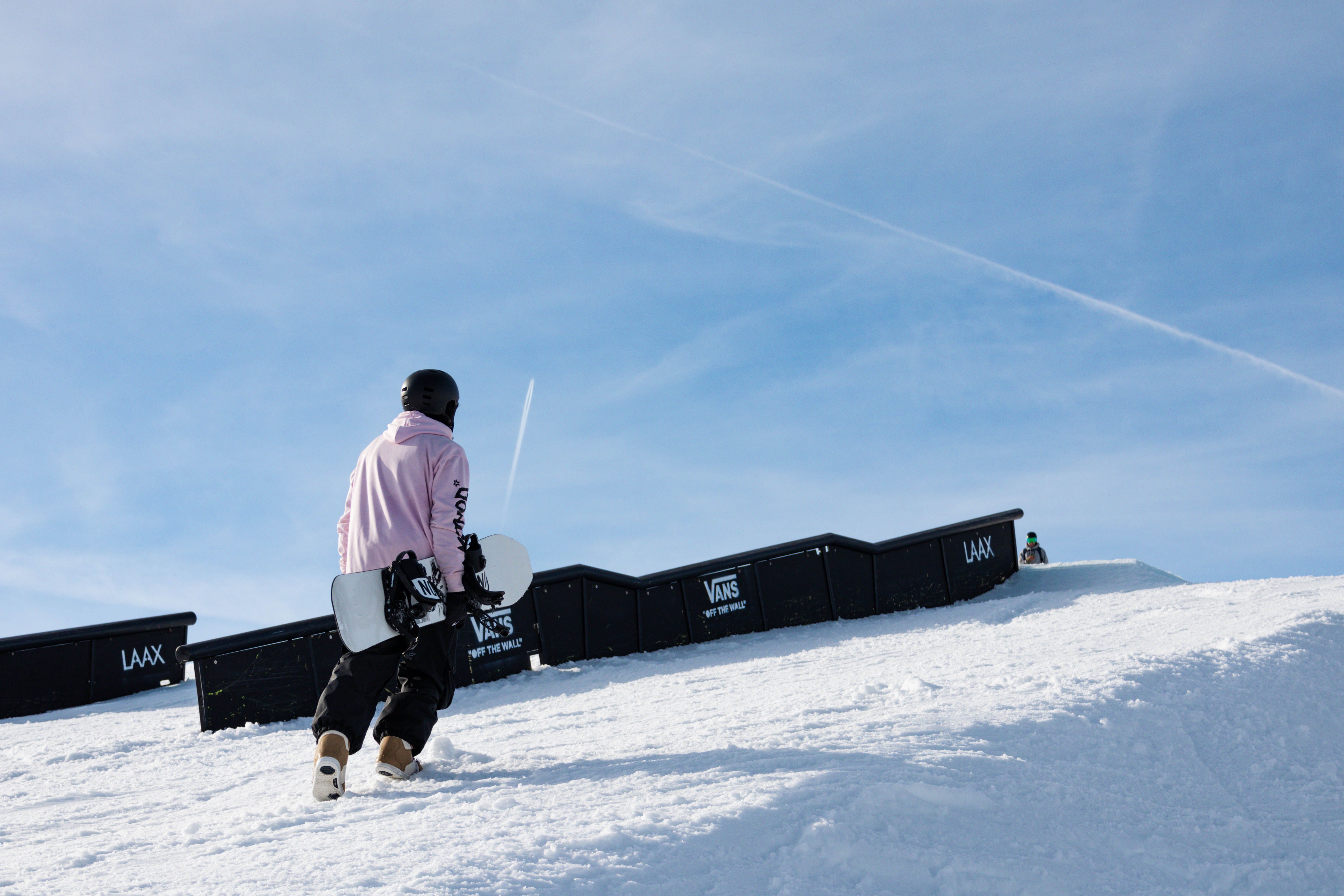 Snowboarder Approaching Snowpark in Laax · Free Stock Photo