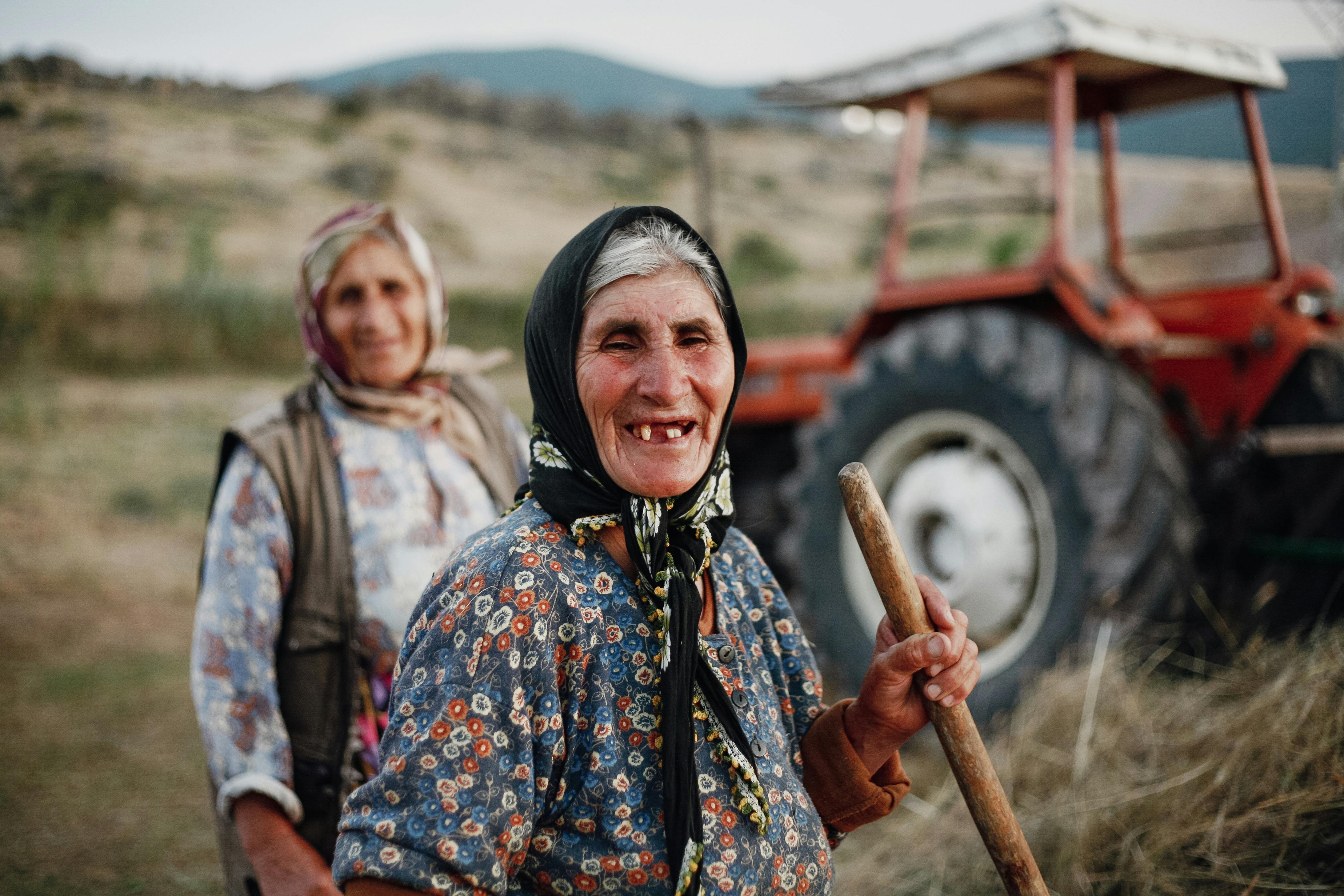 Elderly Women Farmers with Tractor in Field · Free Stock Photo