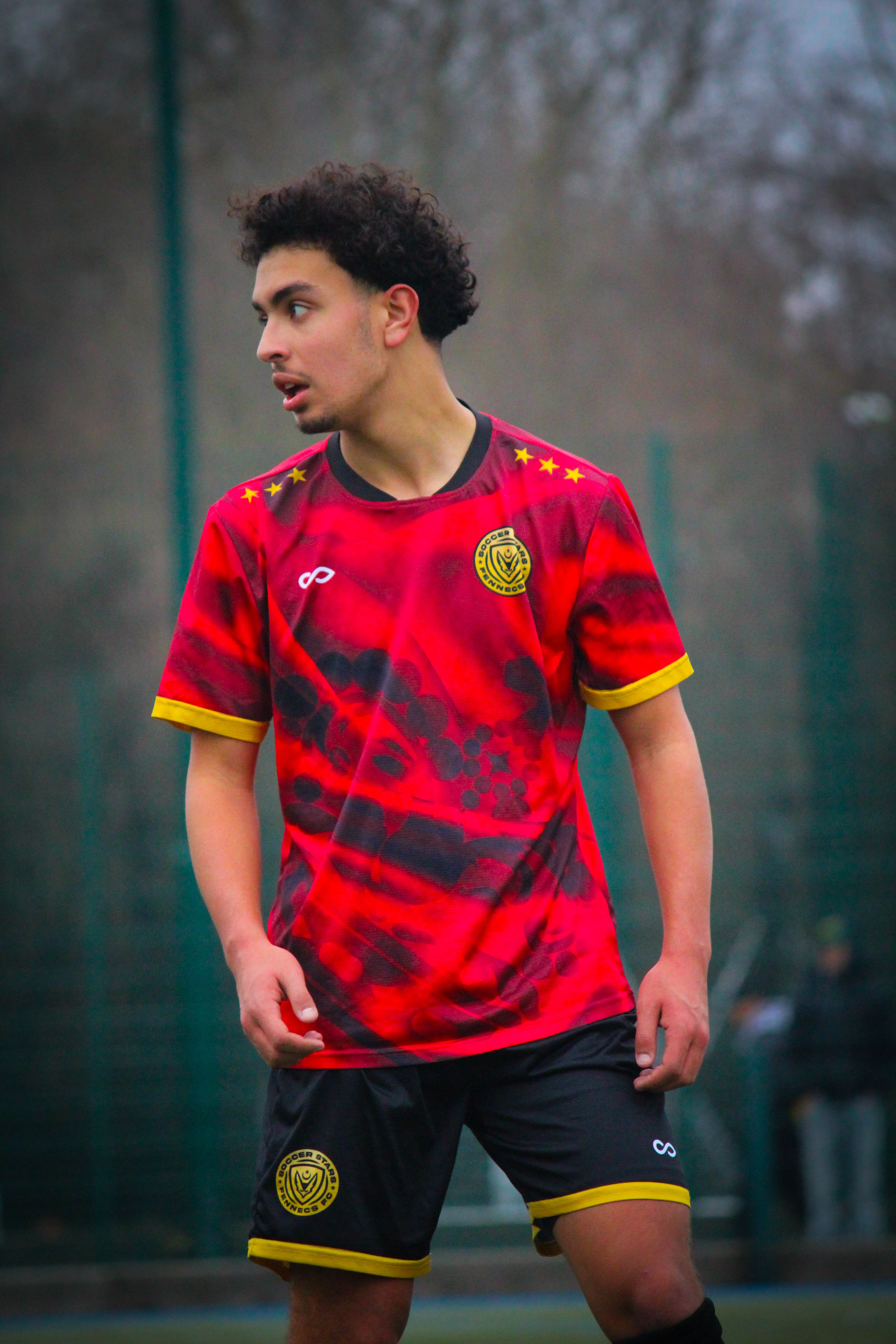 Young Footballer in Vibrant Red Soccer Jersey · Free Stock Photo