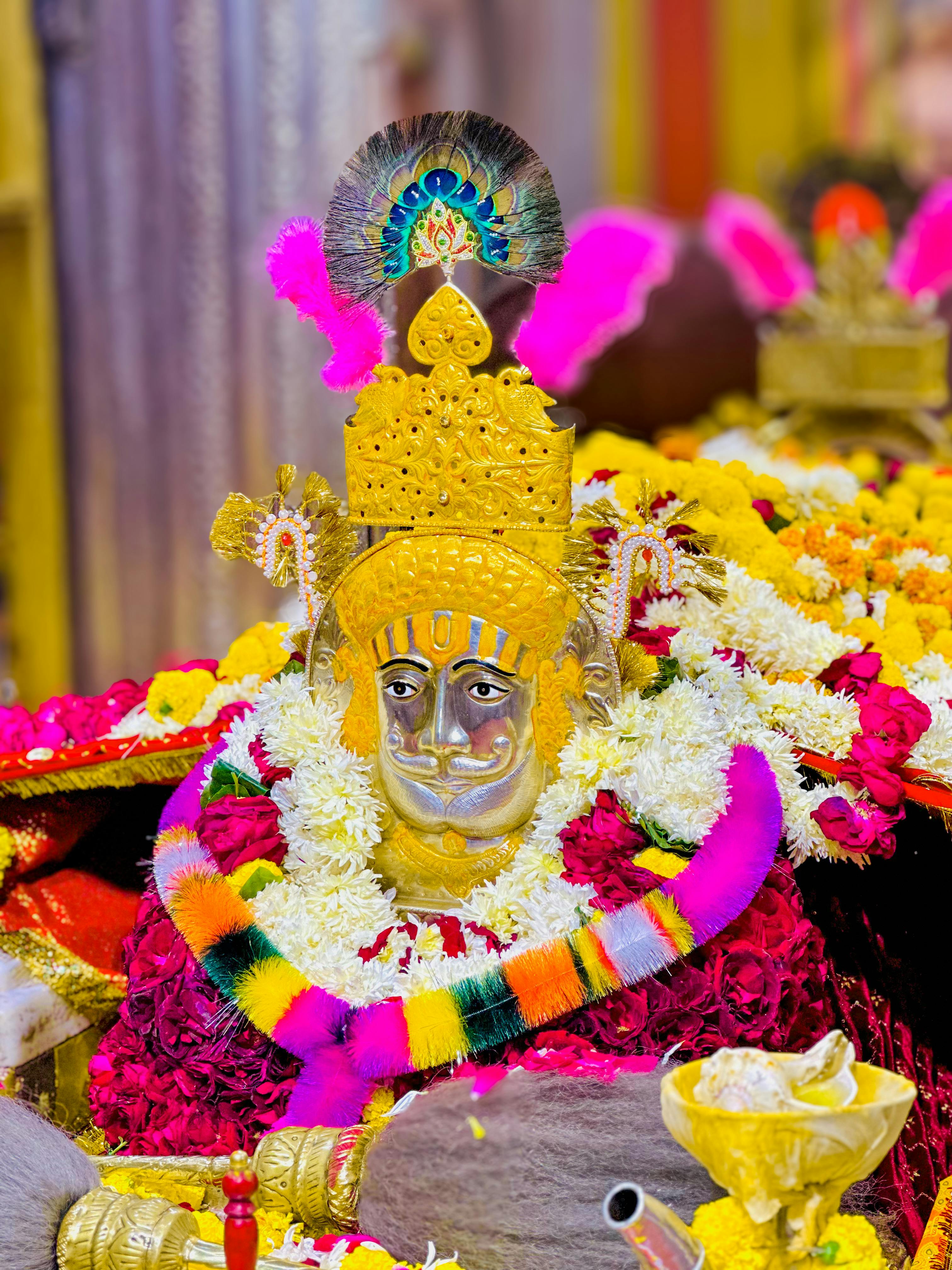 Vibrant Indian Deity Idol Decorated with Flowers · Free Stock Photo