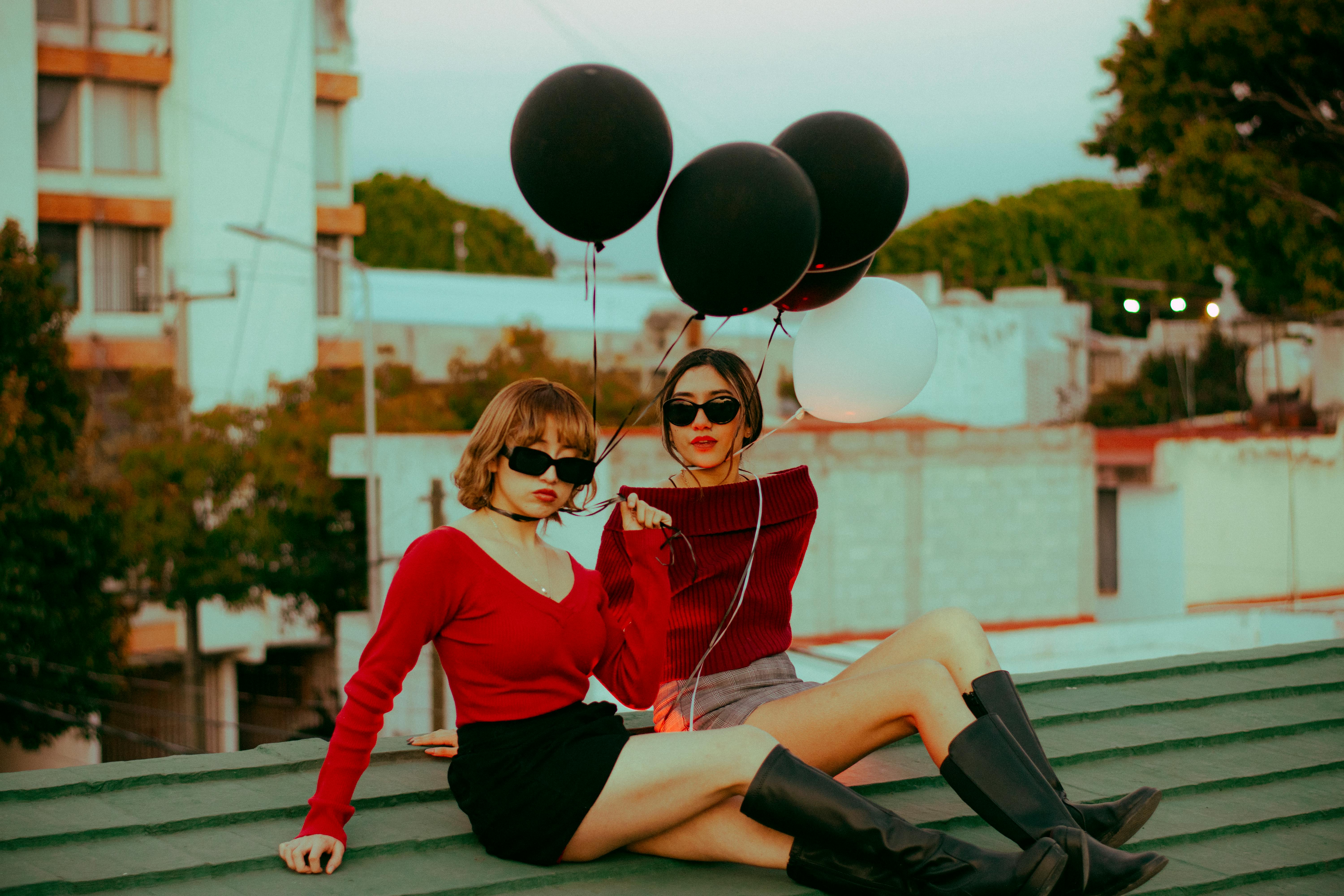 Stylish Rooftop Portrait with Balloons · Free Stock Photo