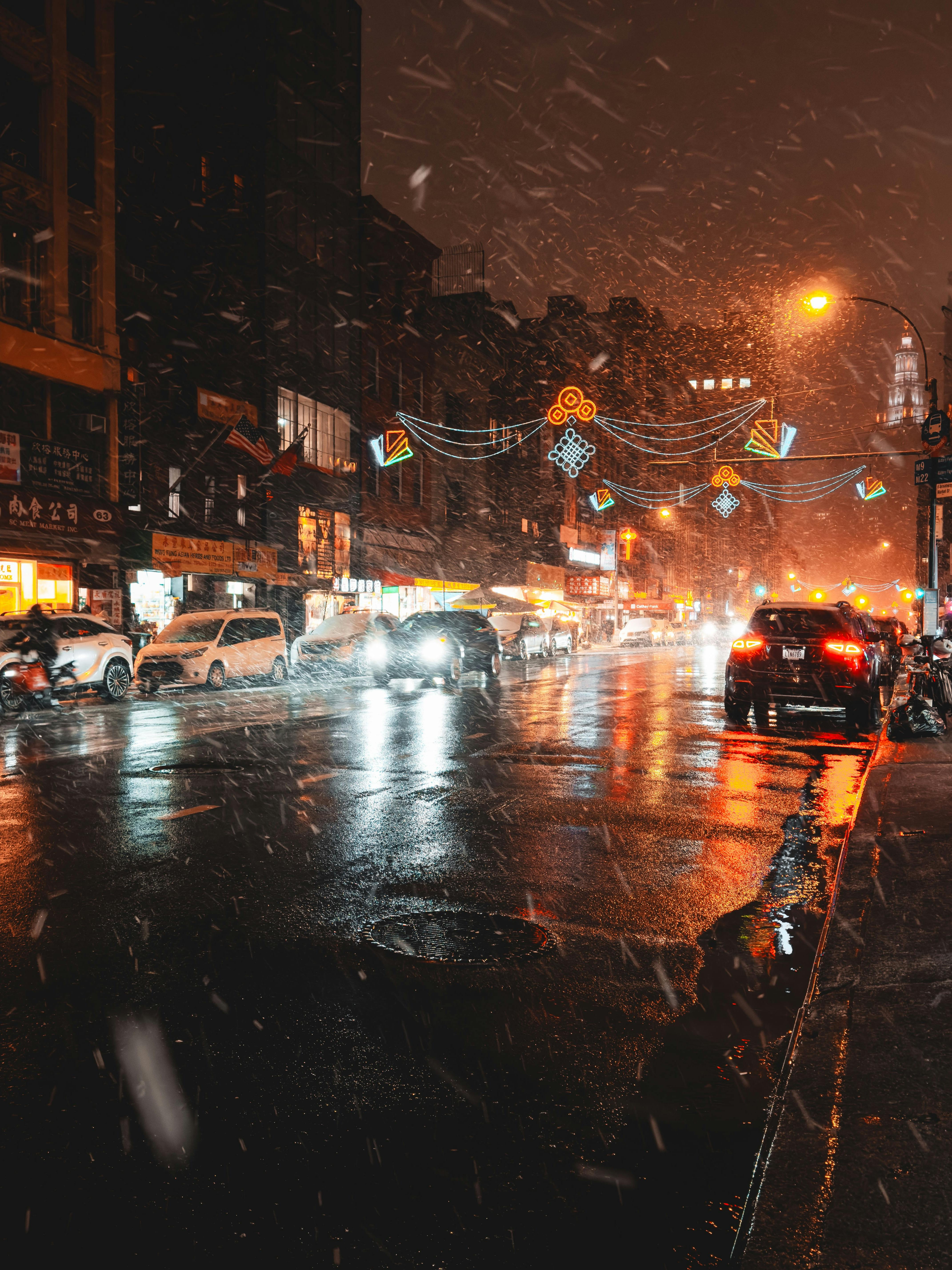 Snowy Night City Street with Festive Lights · Free Stock Photo