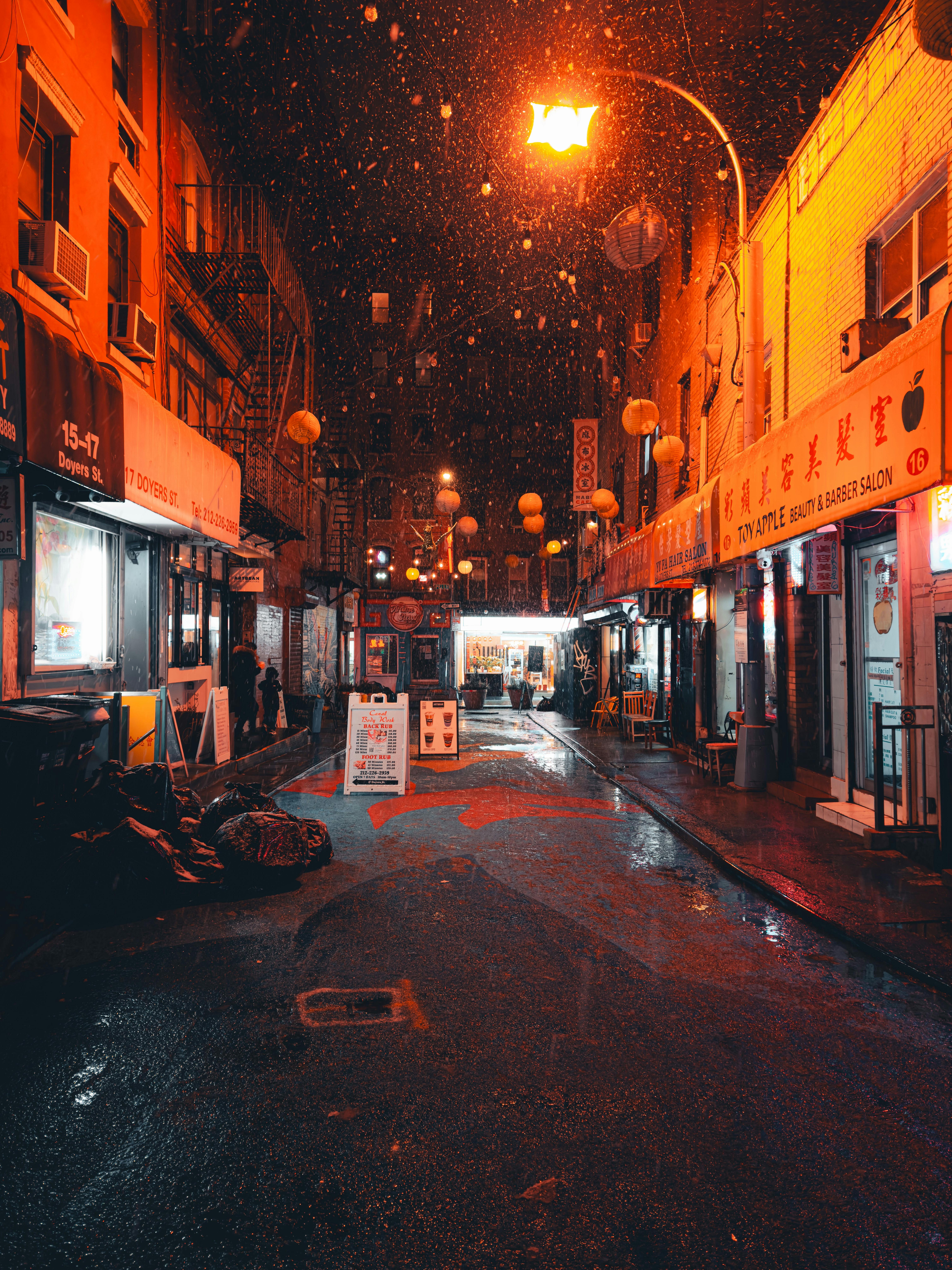Night Street Scene with Neon Lights in Snowfall · Free Stock Photo