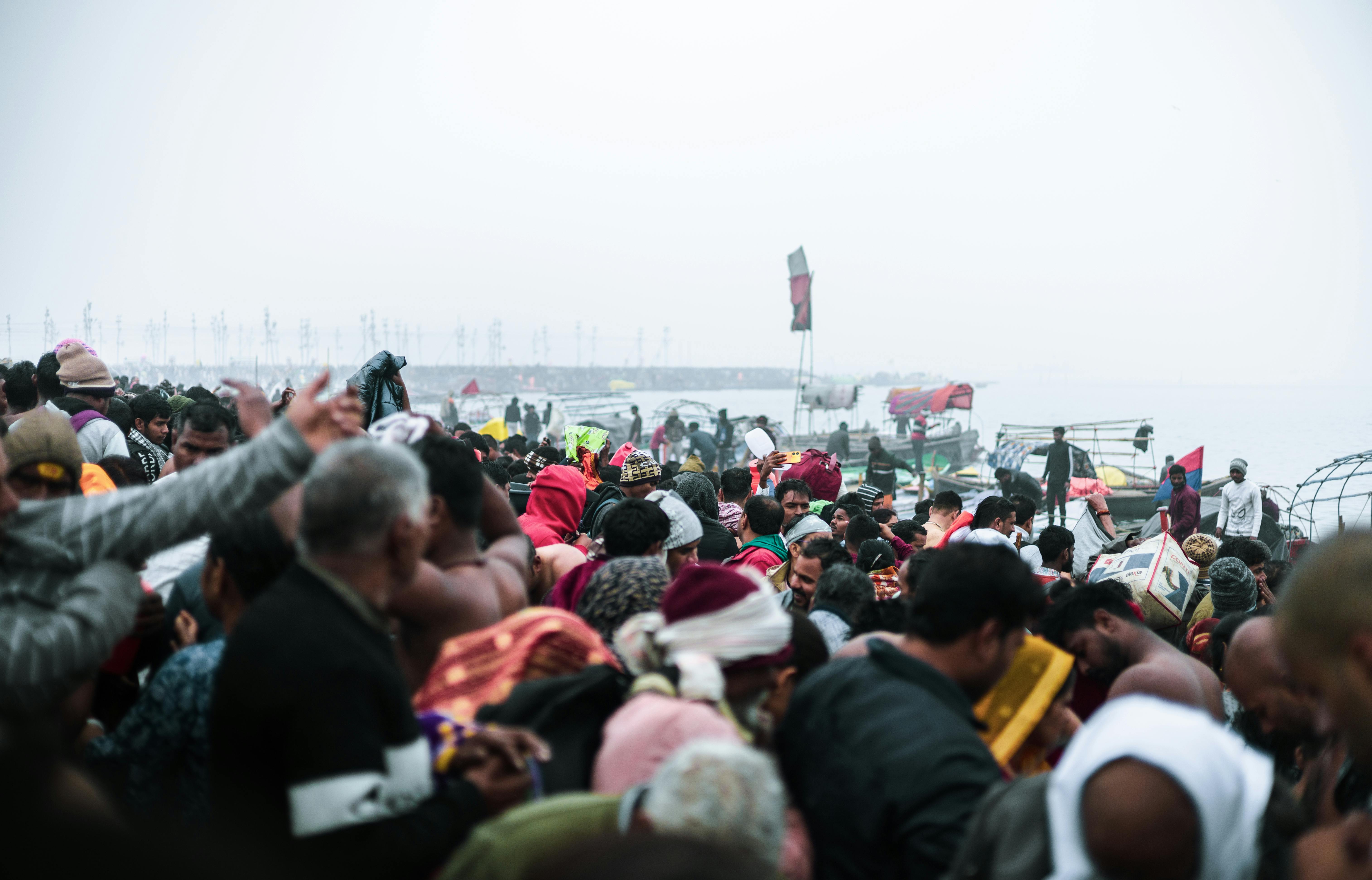 Crowded riverside ceremony with many people · Free Stock Photo