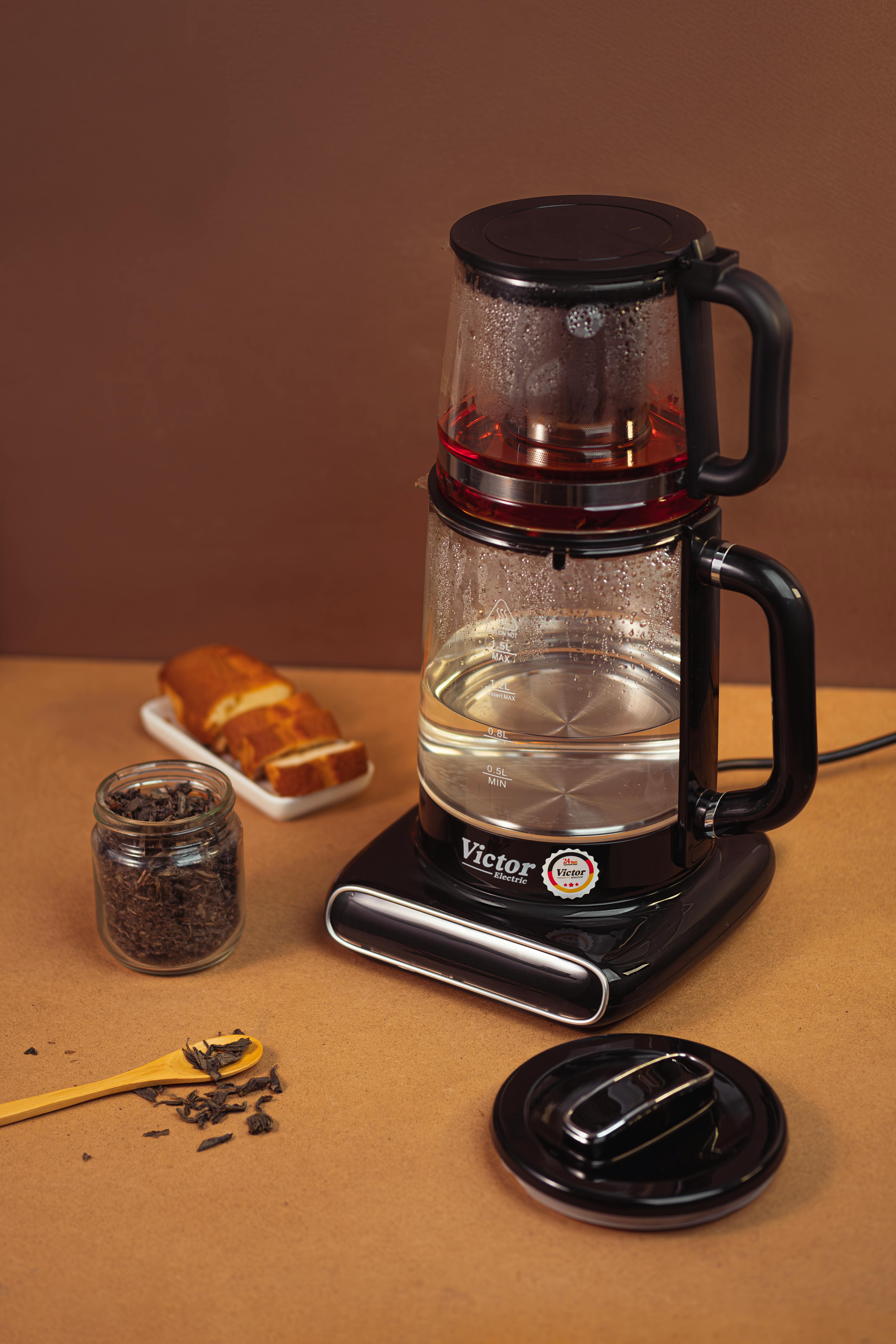 Elegant Electric Kettle with Tea and Cake Setup · Free Stock Photo