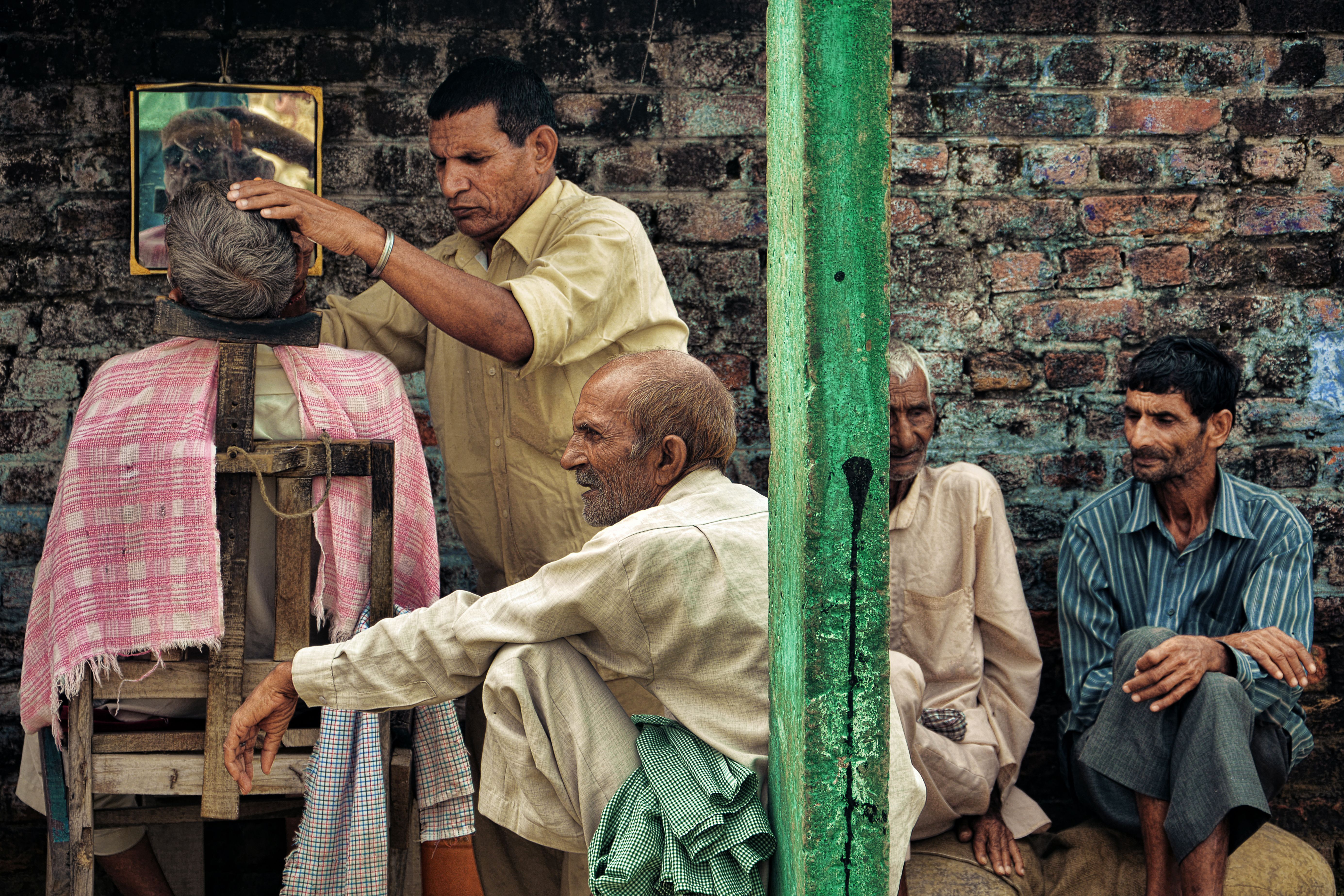 Traditional Street Barber in Rural Setting · Free Stock Photo