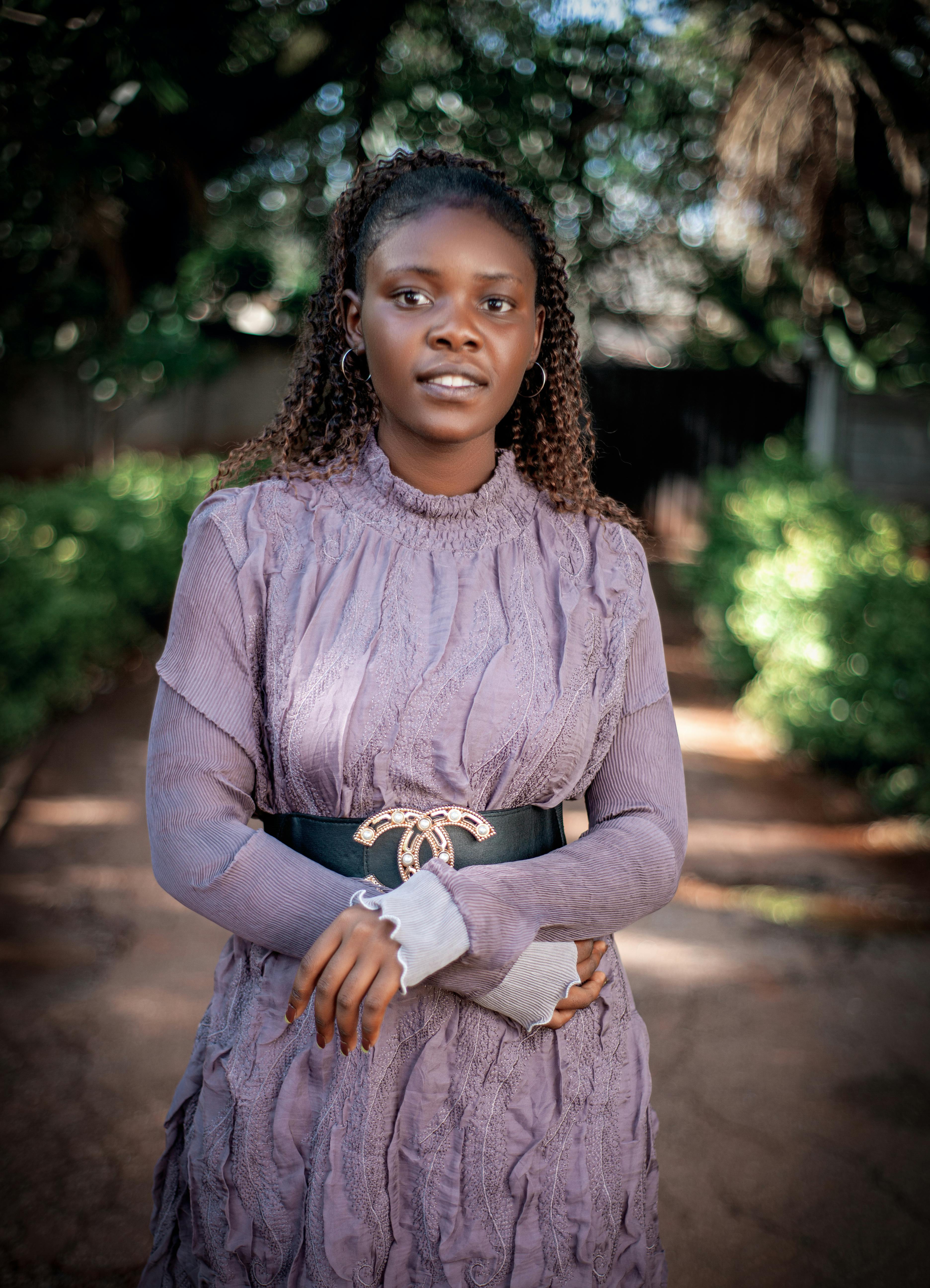 Elegant Woman in Purple Dress Outdoors · Free Stock Photo