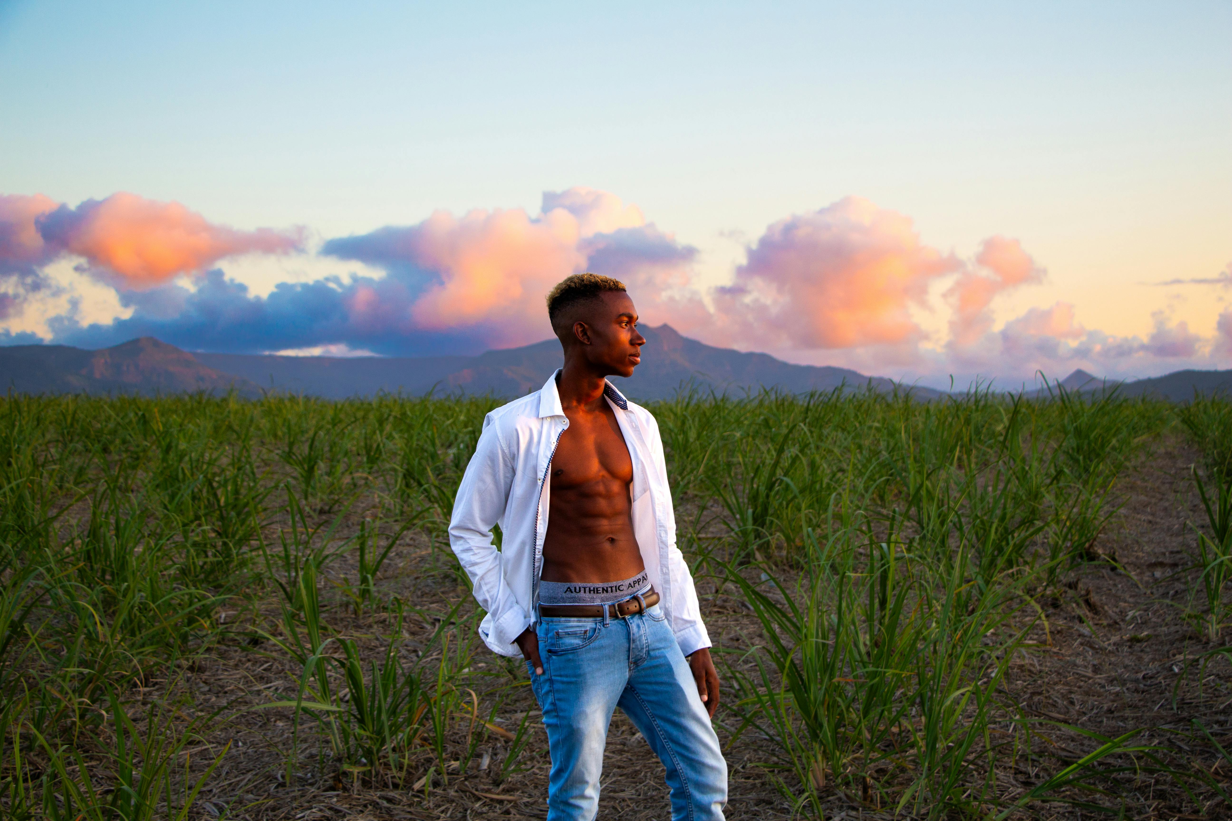 Young Man at Sunset in Mauritius Field · Free Stock Photo