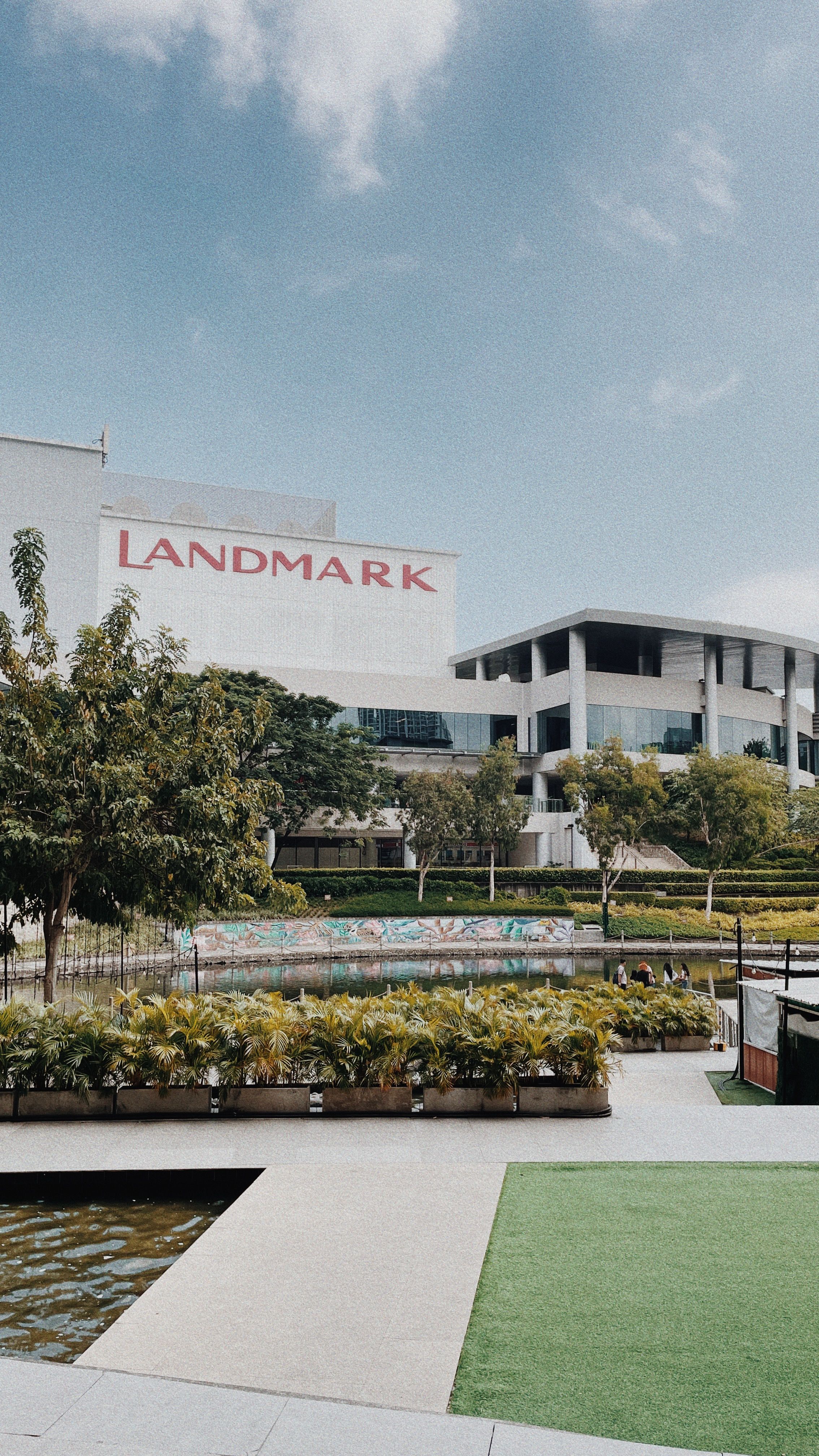 Modern Shopping Mall Exterior with Landscaping · Free Stock Photo