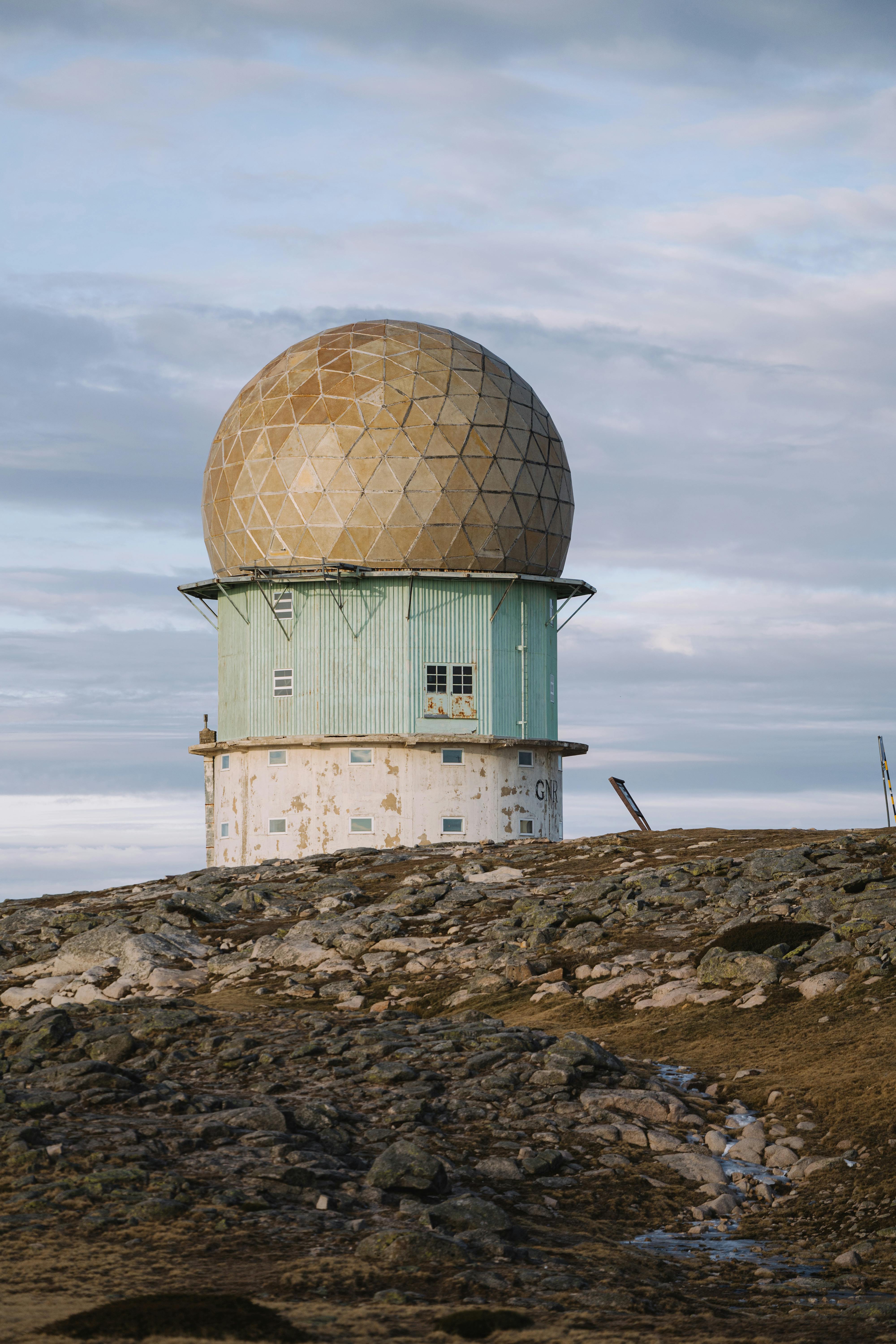 Isolated Radar Dome in Remote Rugged Landscape · Free Stock Photo