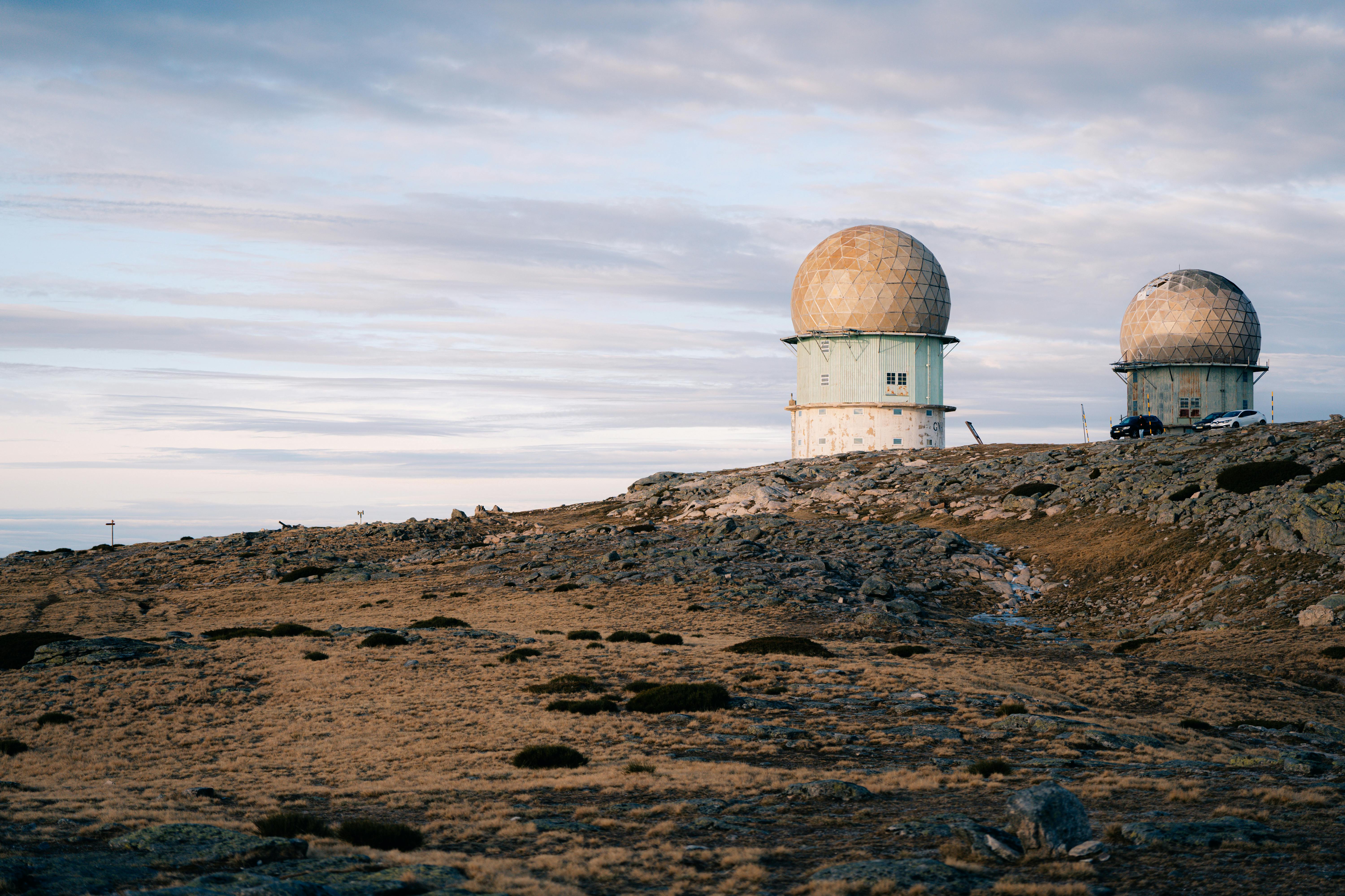 Remote Observatories on Rocky Landscape at Dusk · Free Stock Photo