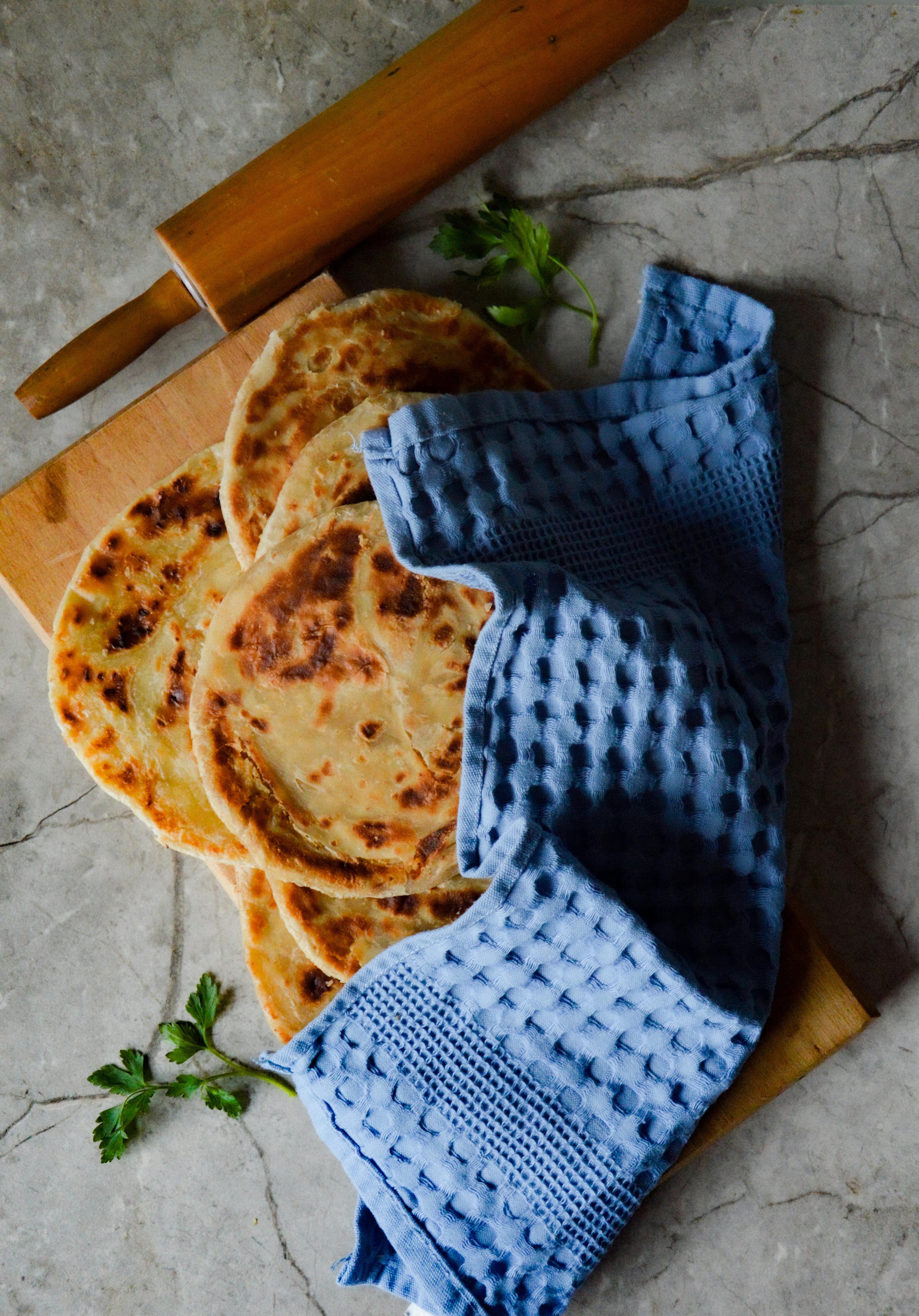 Freshly Baked Flatbreads with Rolling Pin · Free Stock Photo