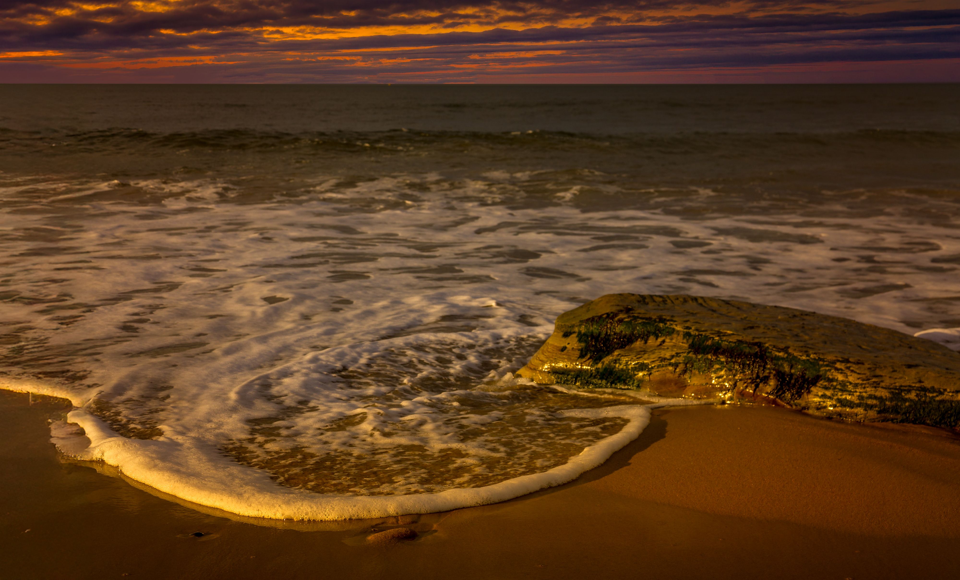 Tranquil Evening Beach Scene with Waves at Sunset · Free Stock Photo
