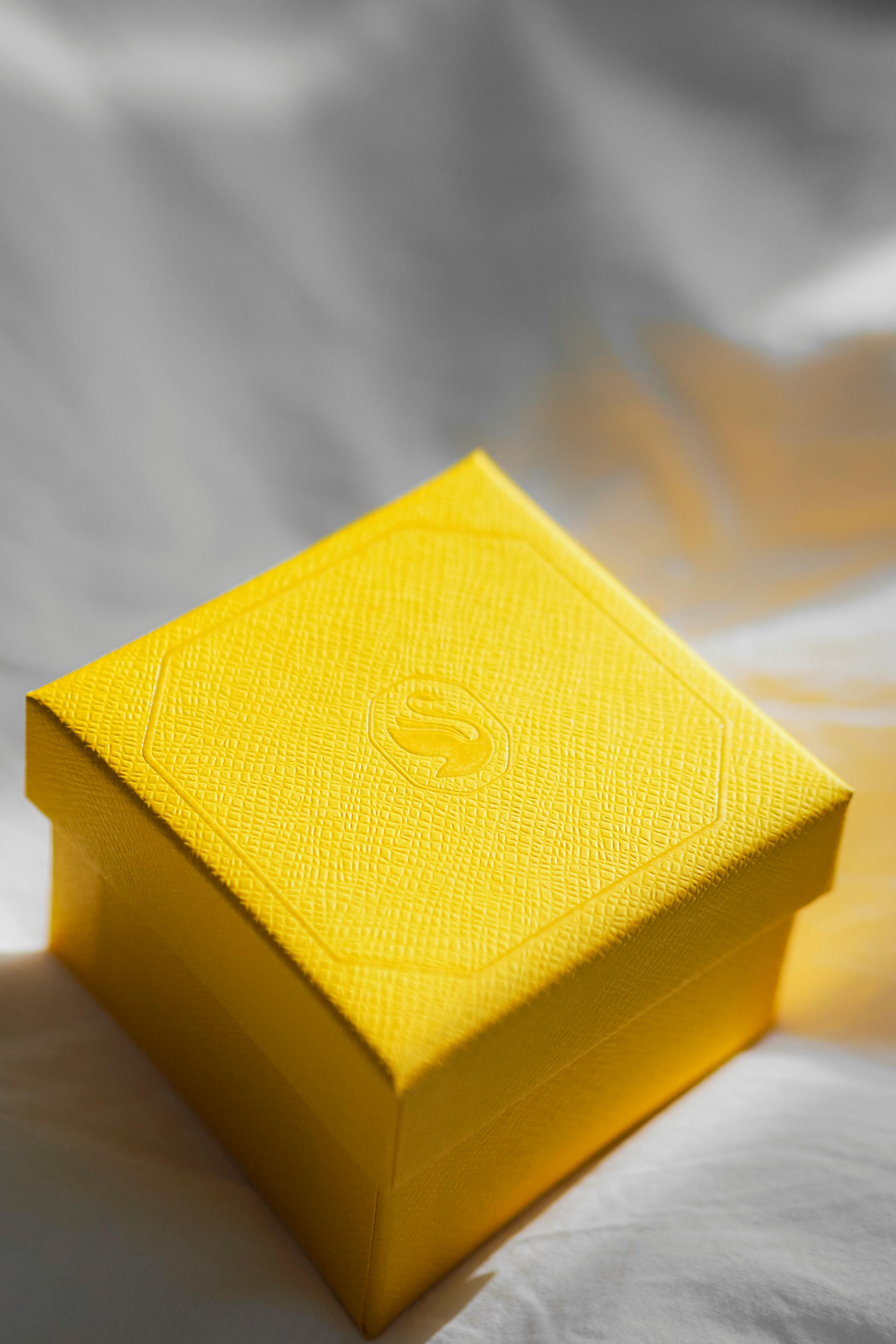 Bright Yellow Gift Box in Soft Lighting · Free Stock Photo