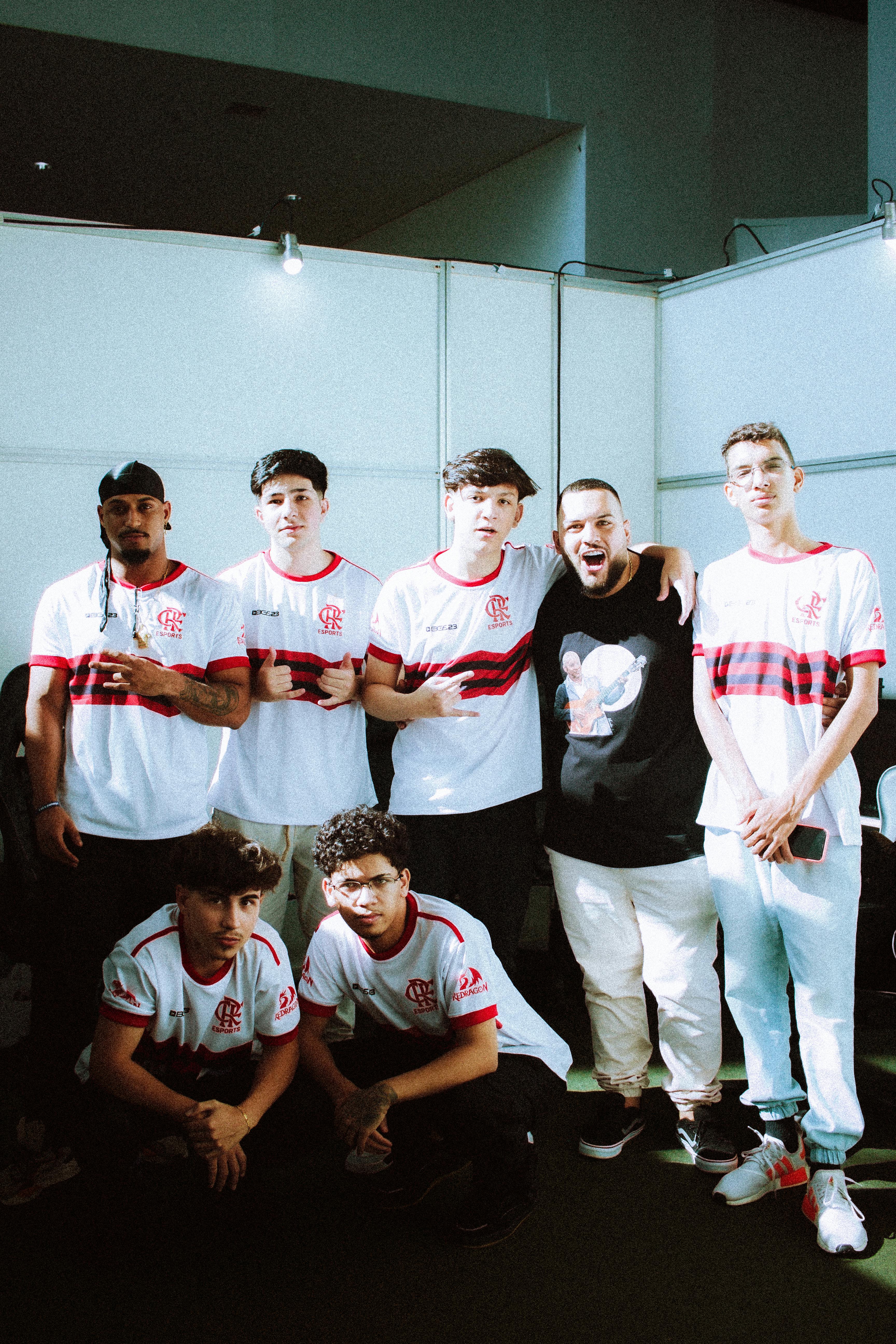 Group of Young Men in Team Uniforms Indoors · Free Stock Photo