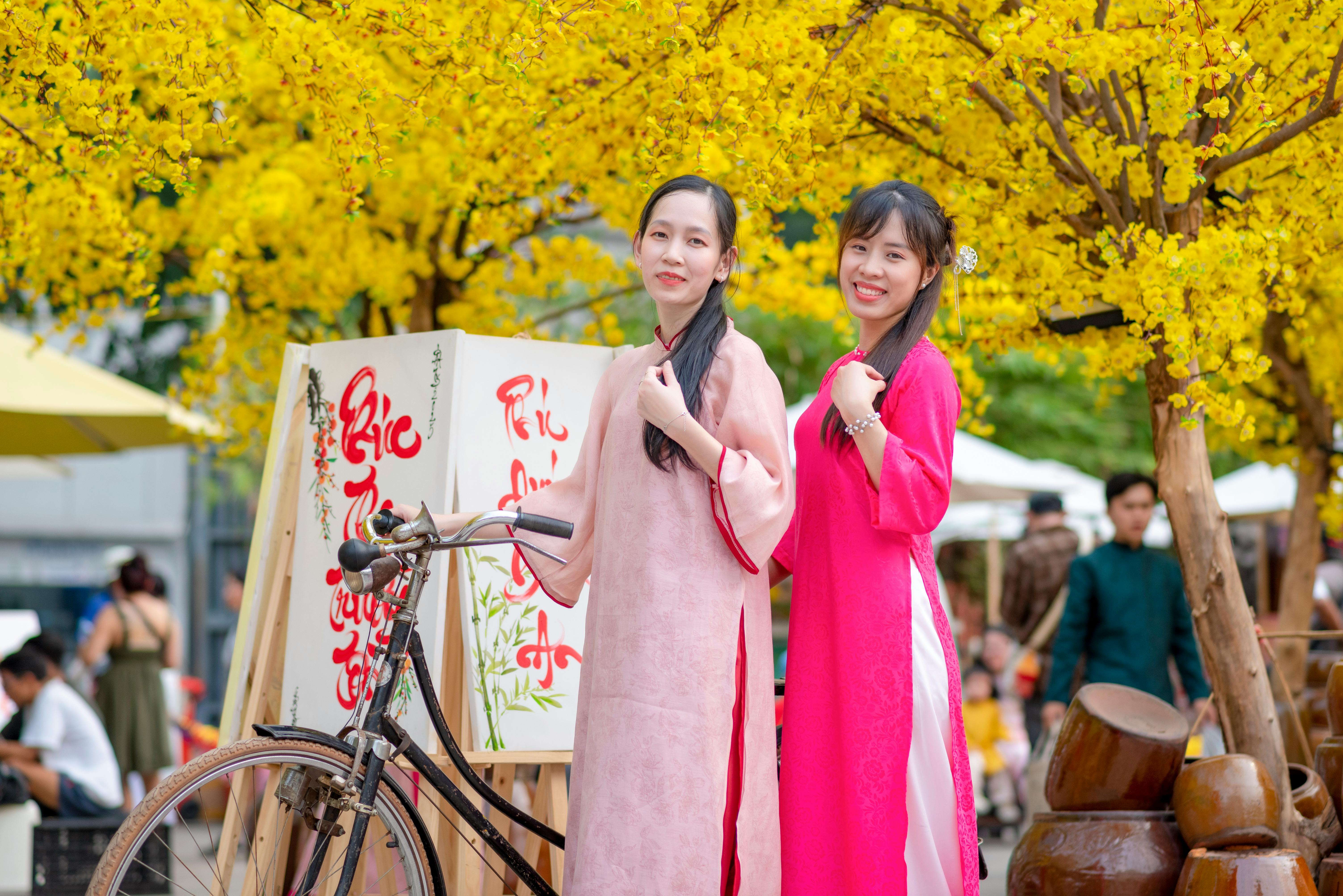 Women Celebrating Tet Festival in Traditional Ao Dai · Free Stock Photo