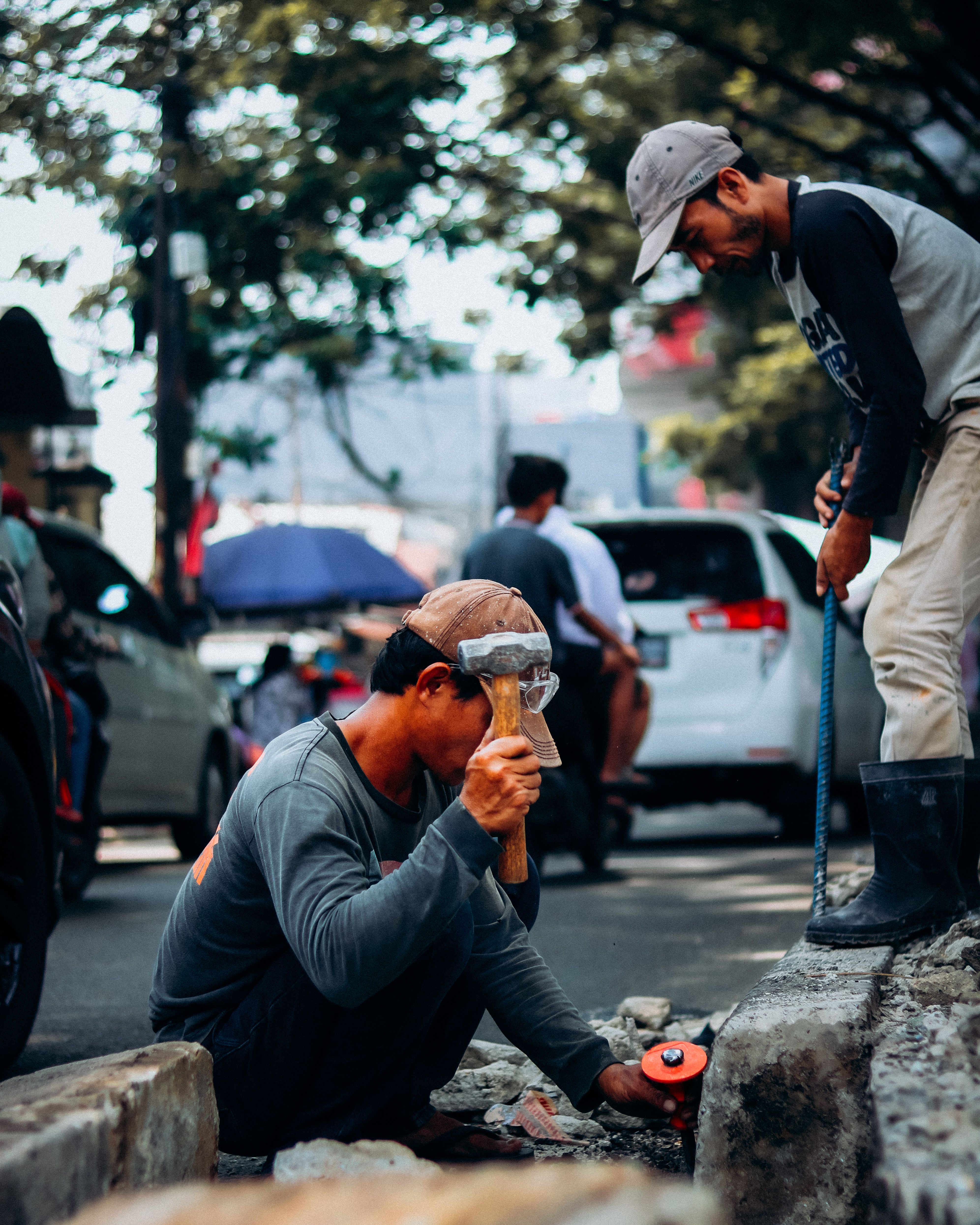 Street Workers in Jakarta Performing Road Maintenance · Free Stock Photo