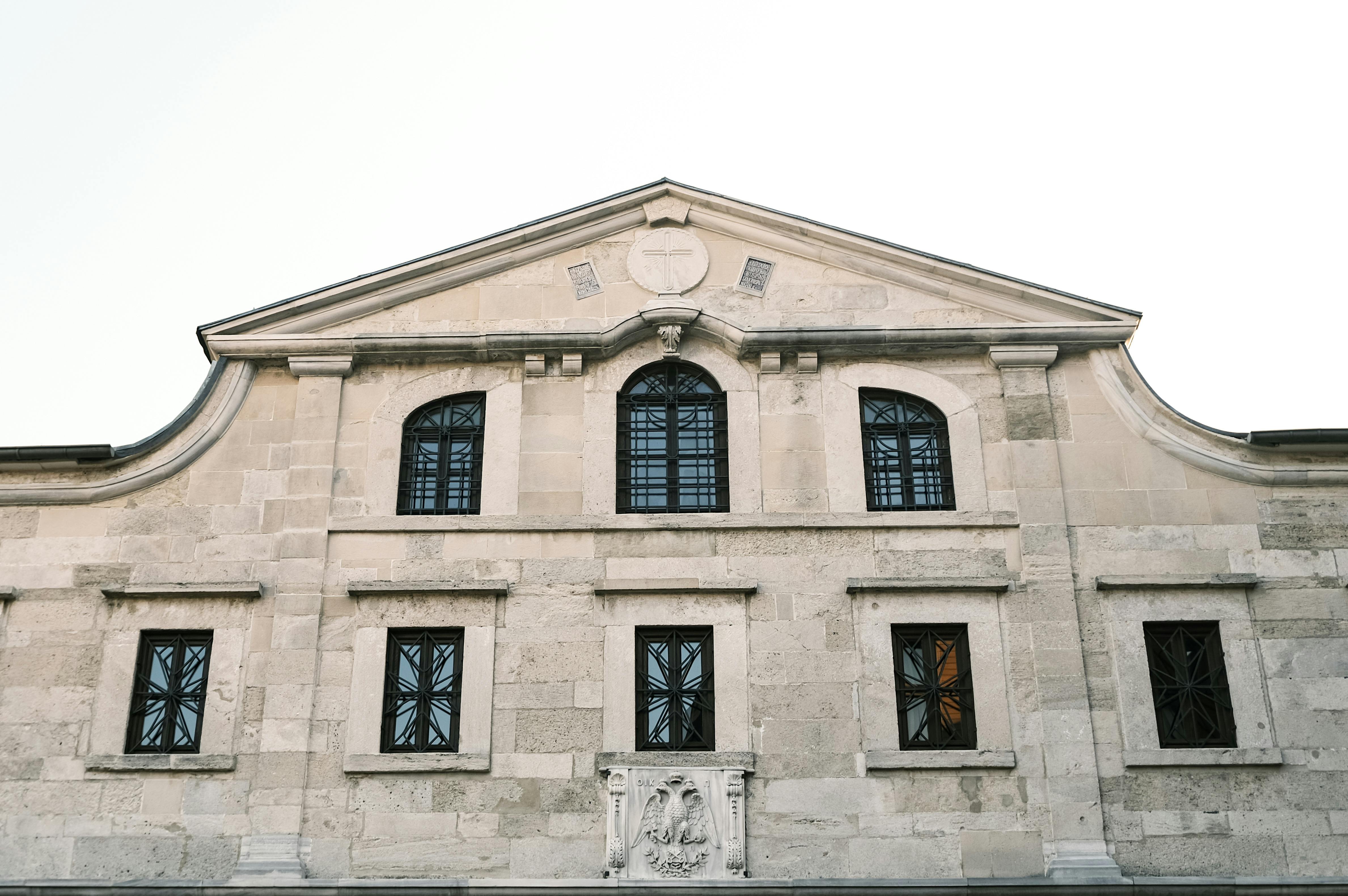 Historic Stone Building with Symmetrical Facade · Free Stock Photo