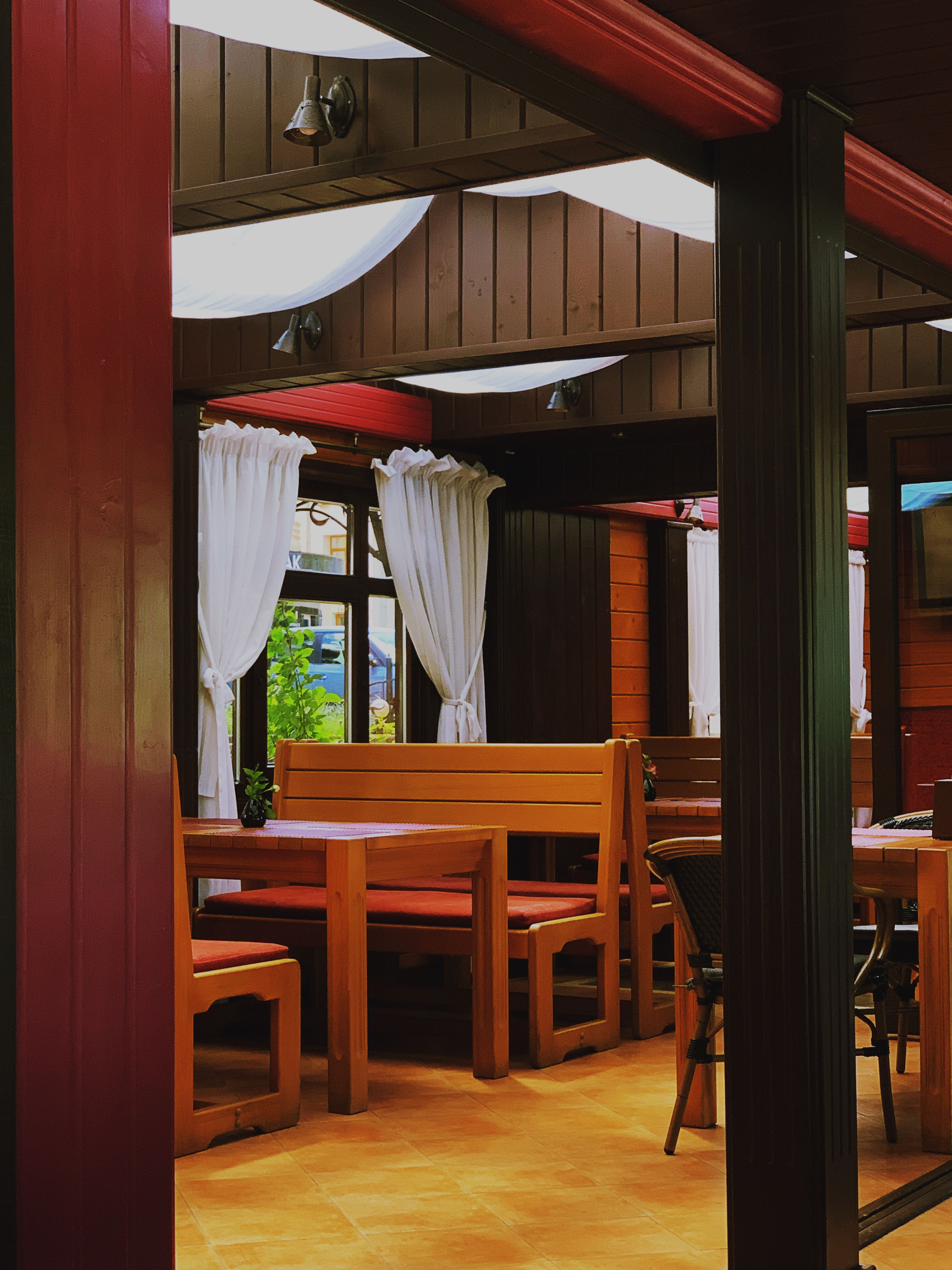 Cozy Ukrainian Cafe Interior with Wooden Seating · Free Stock Photo