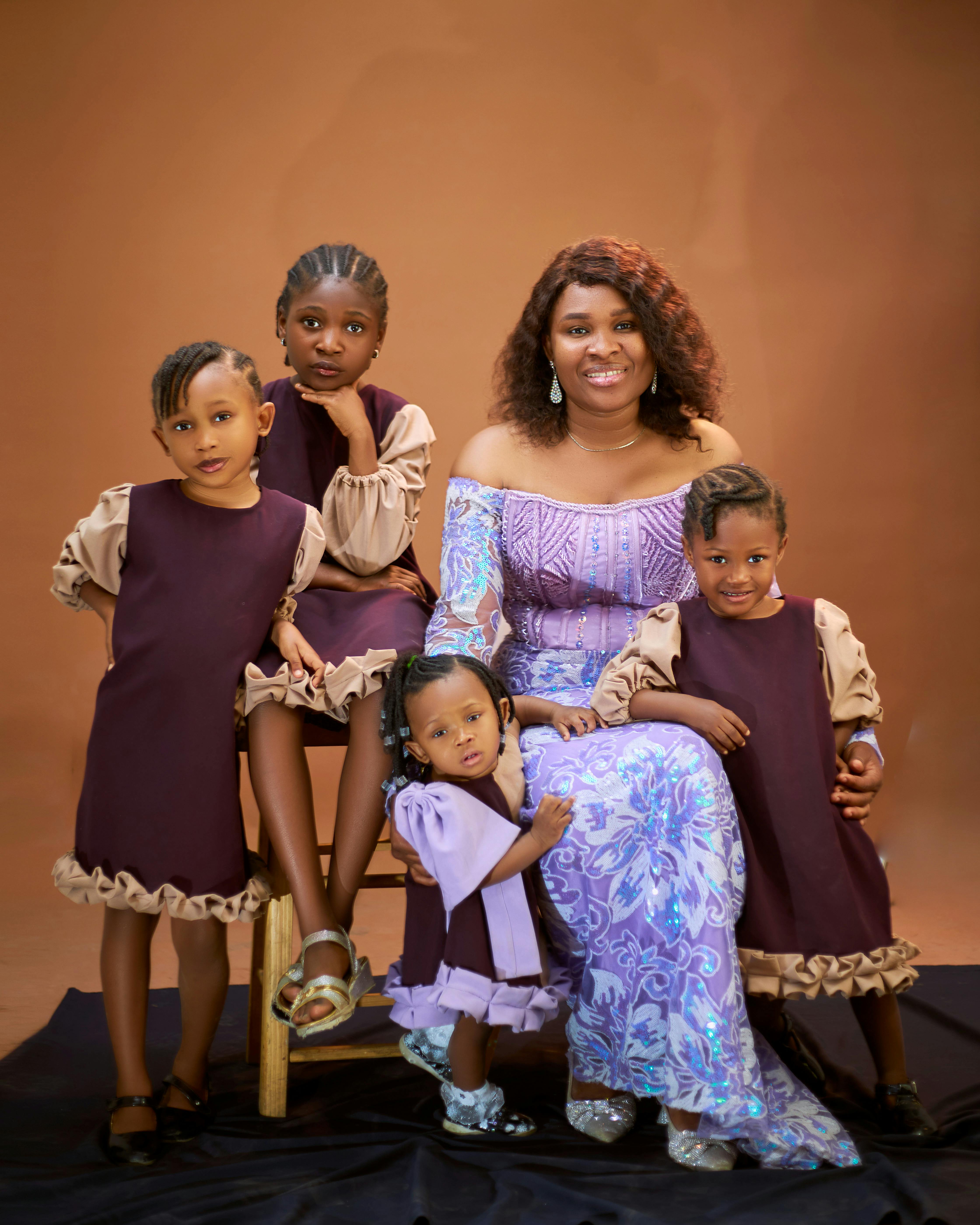 Elegant Family Portrait of Mother and Daughters · Free Stock Photo