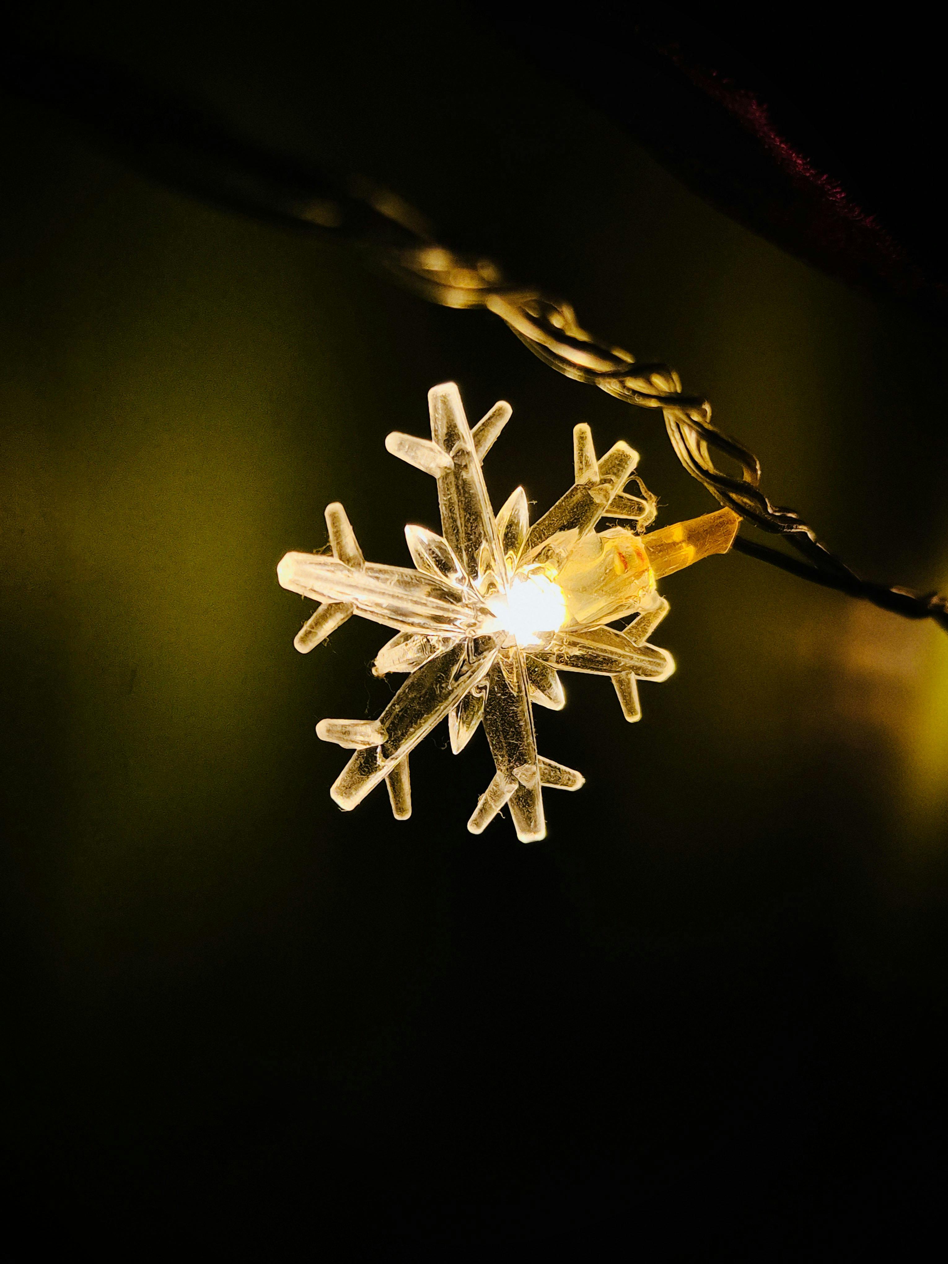 Festive Snowflake String Light Close-Up · Free Stock Photo