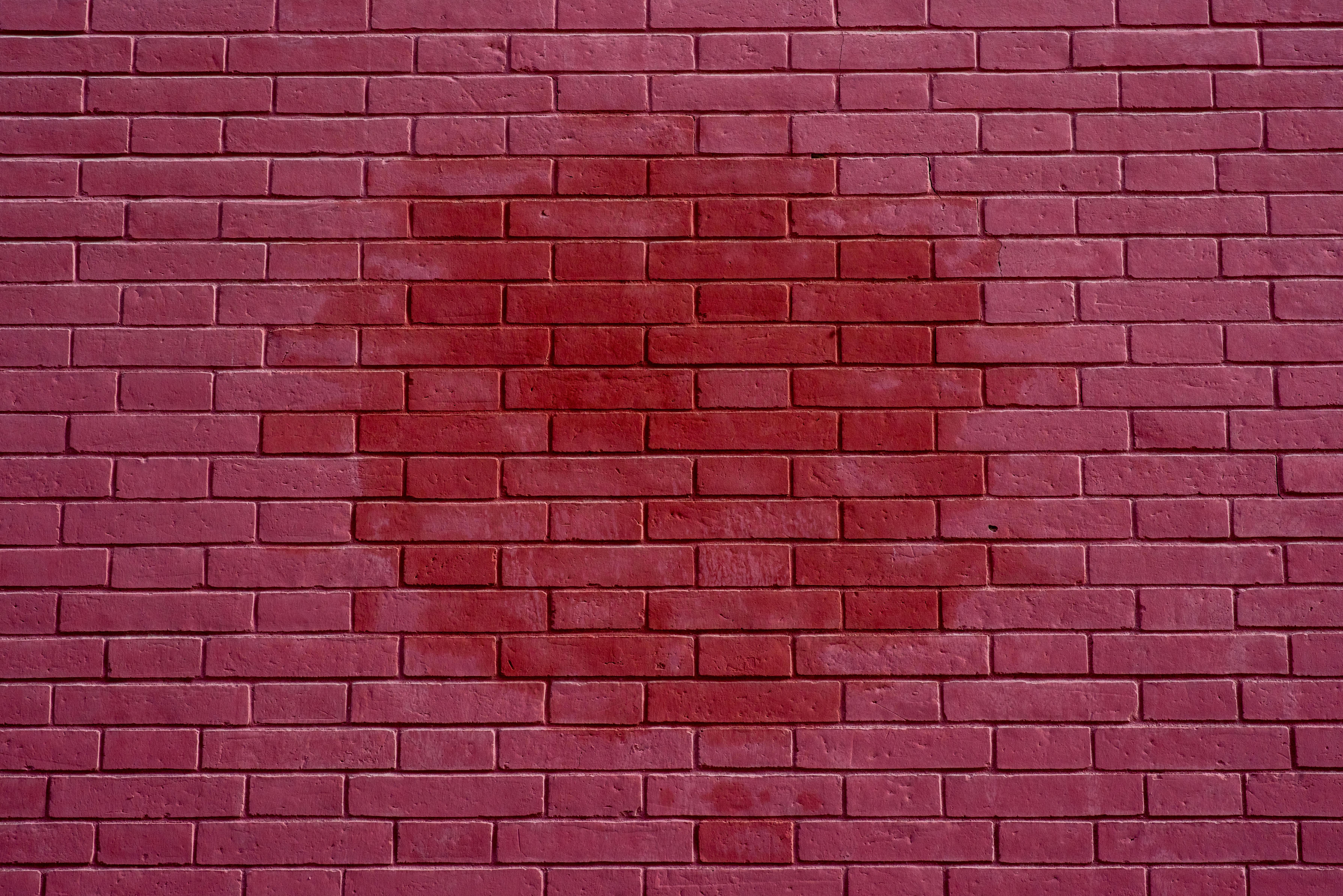 Red Brick Wall with Circular Stain Pattern · Free Stock Photo