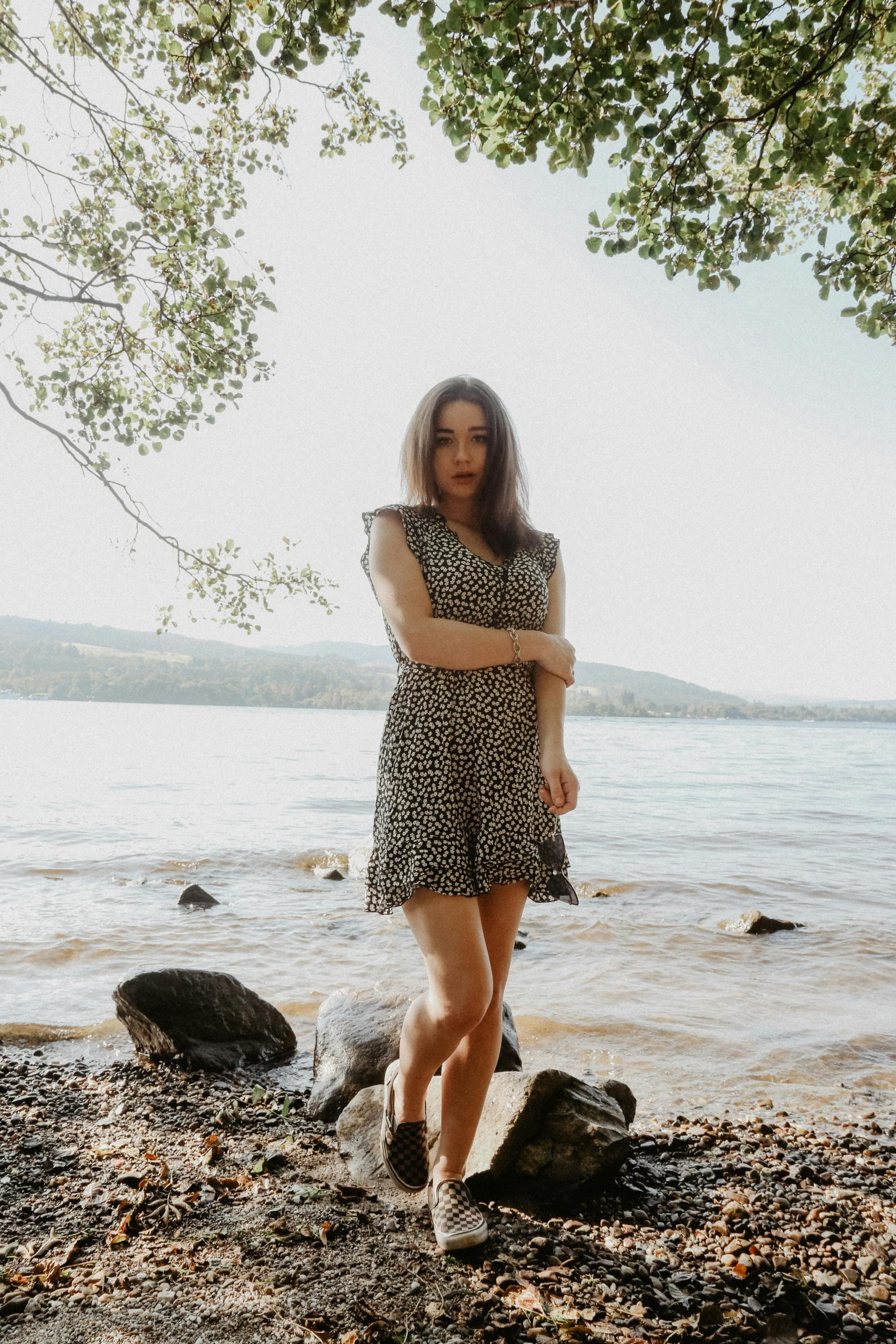 A Woman Standing Beside the Tree · Free Stock Photo