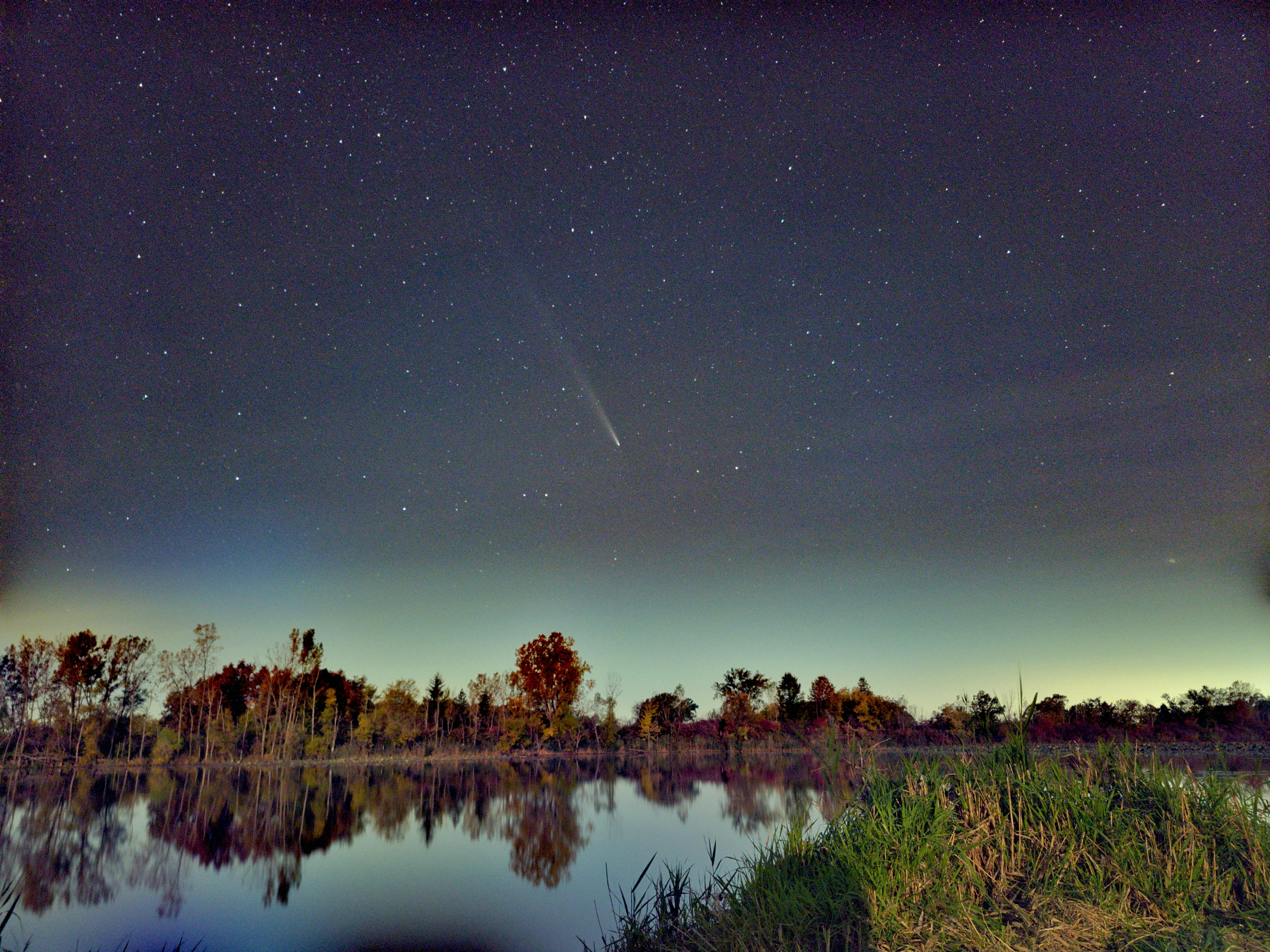 Starlit Night Sky with Comet over Calm Lake · Free Stock Photo