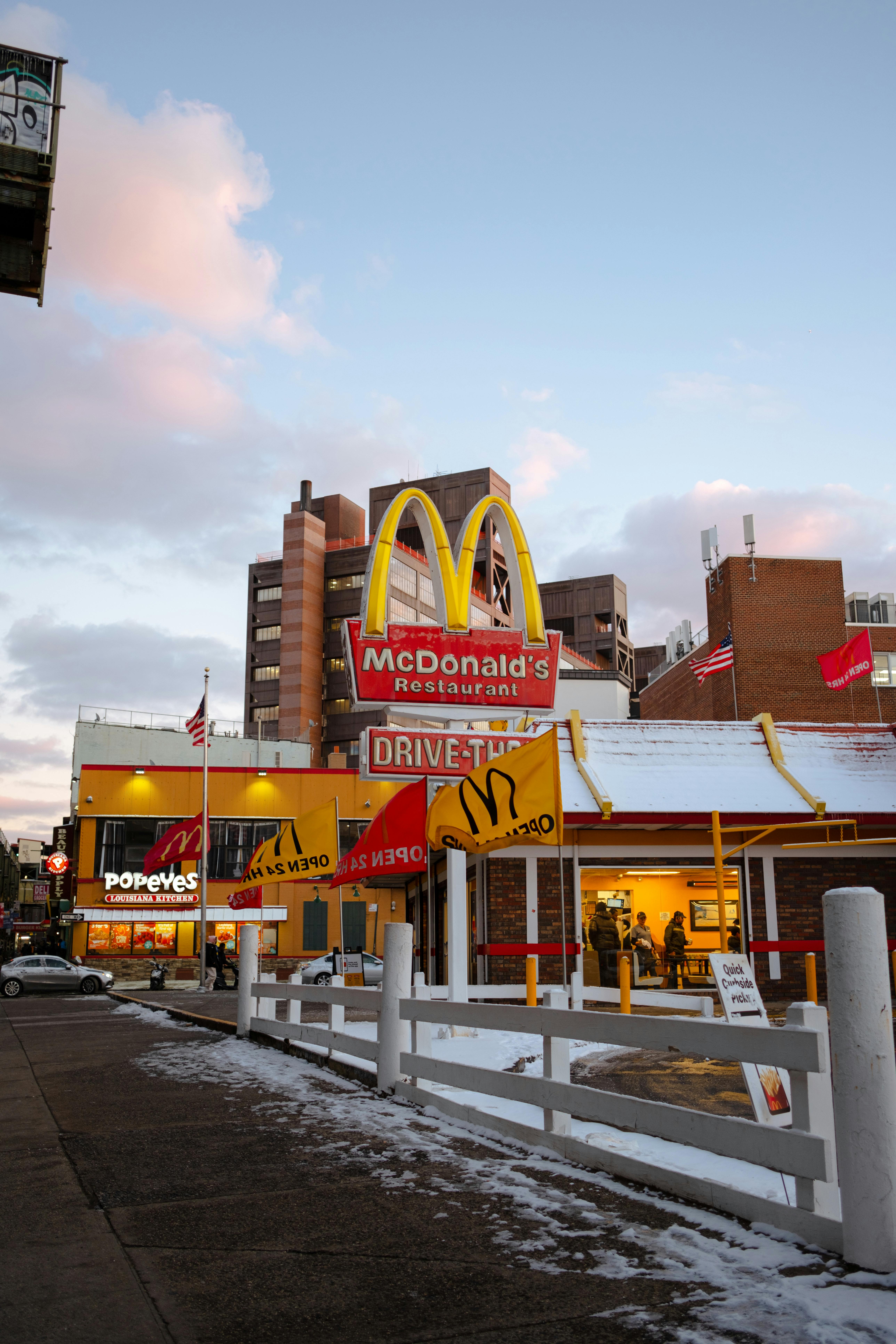 McDonald's drive-thru at sunset in urban setting · Free Stock Photo