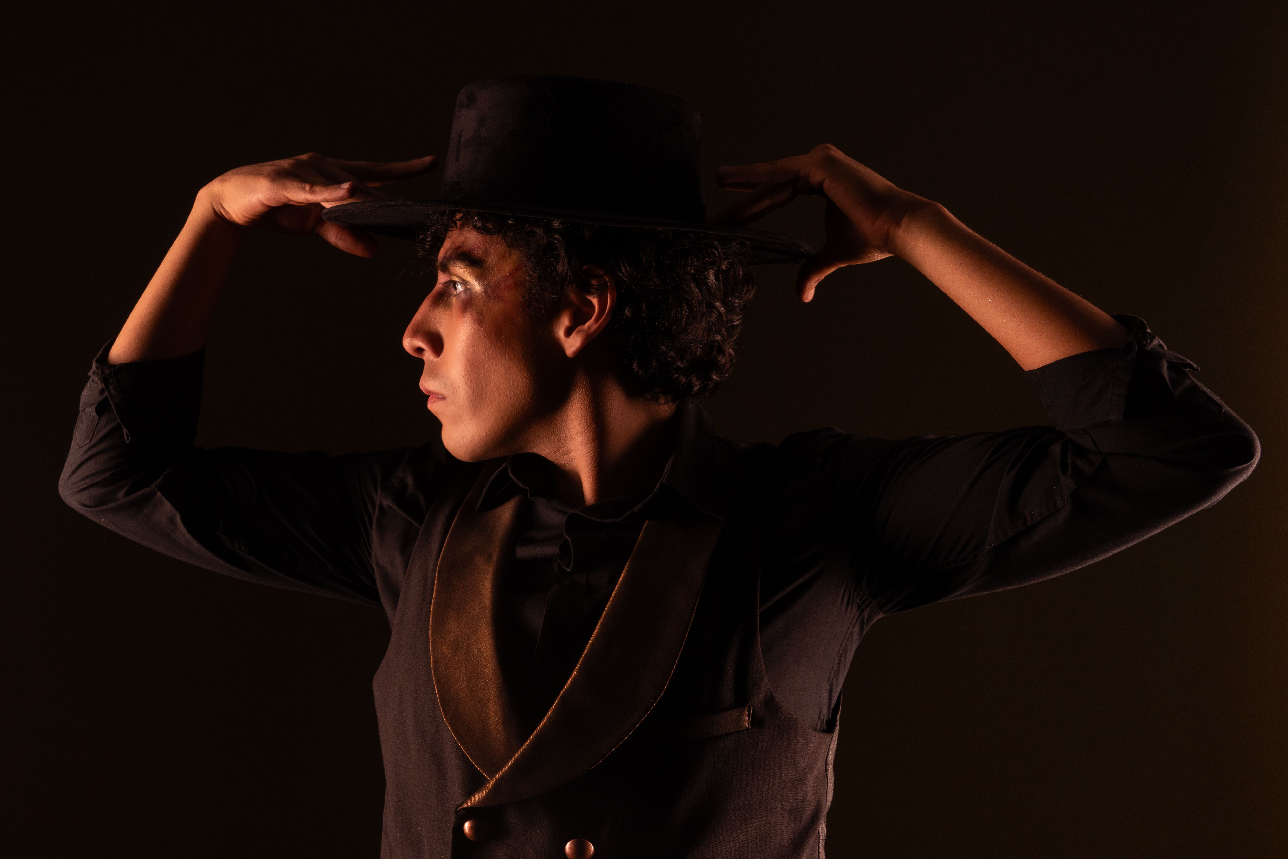 Elegant Male Dancer in Dramatic Lighting · Free Stock Photo