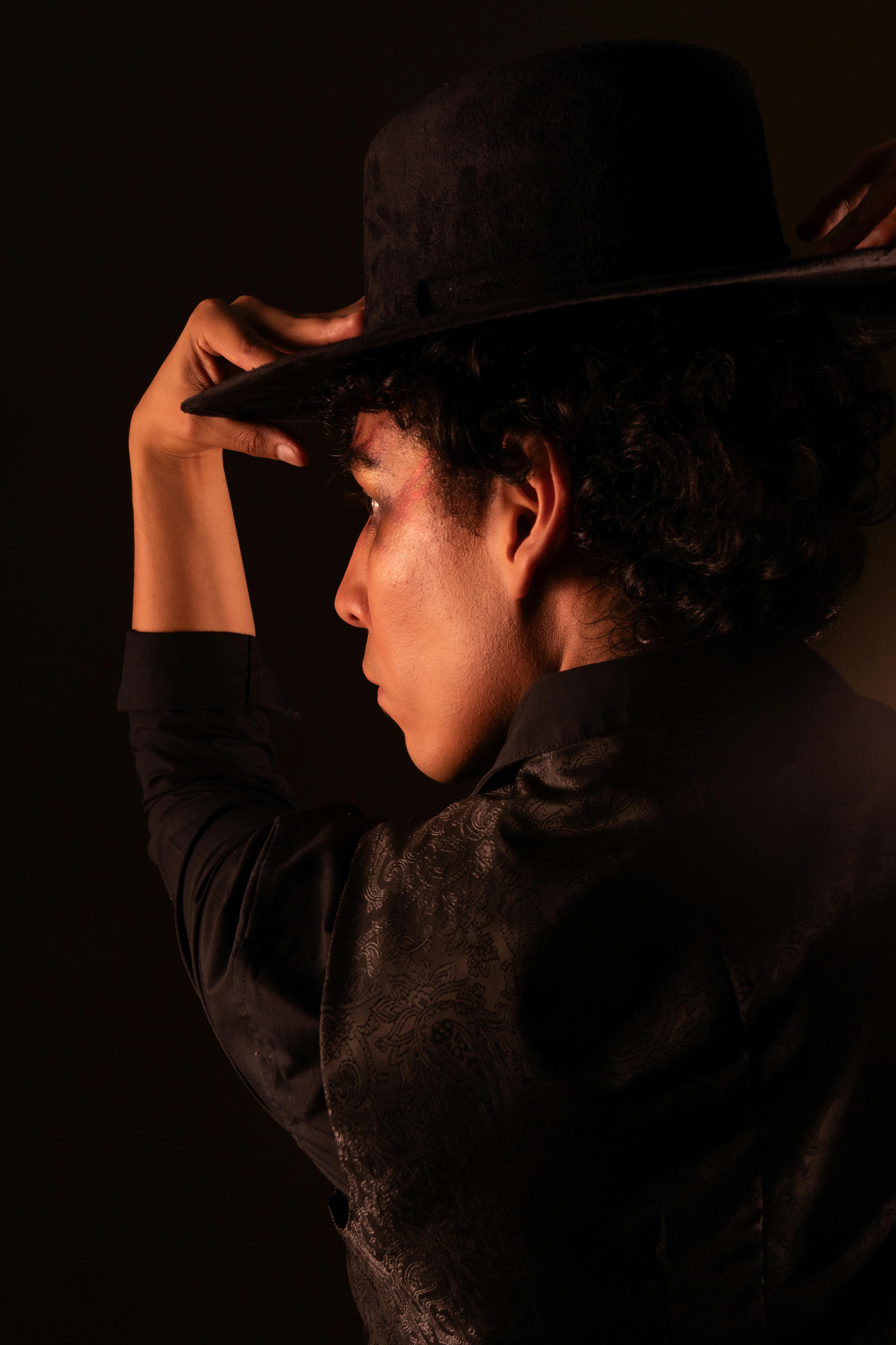 Elegant Male Dancer in Dramatic Lighting · Free Stock Photo