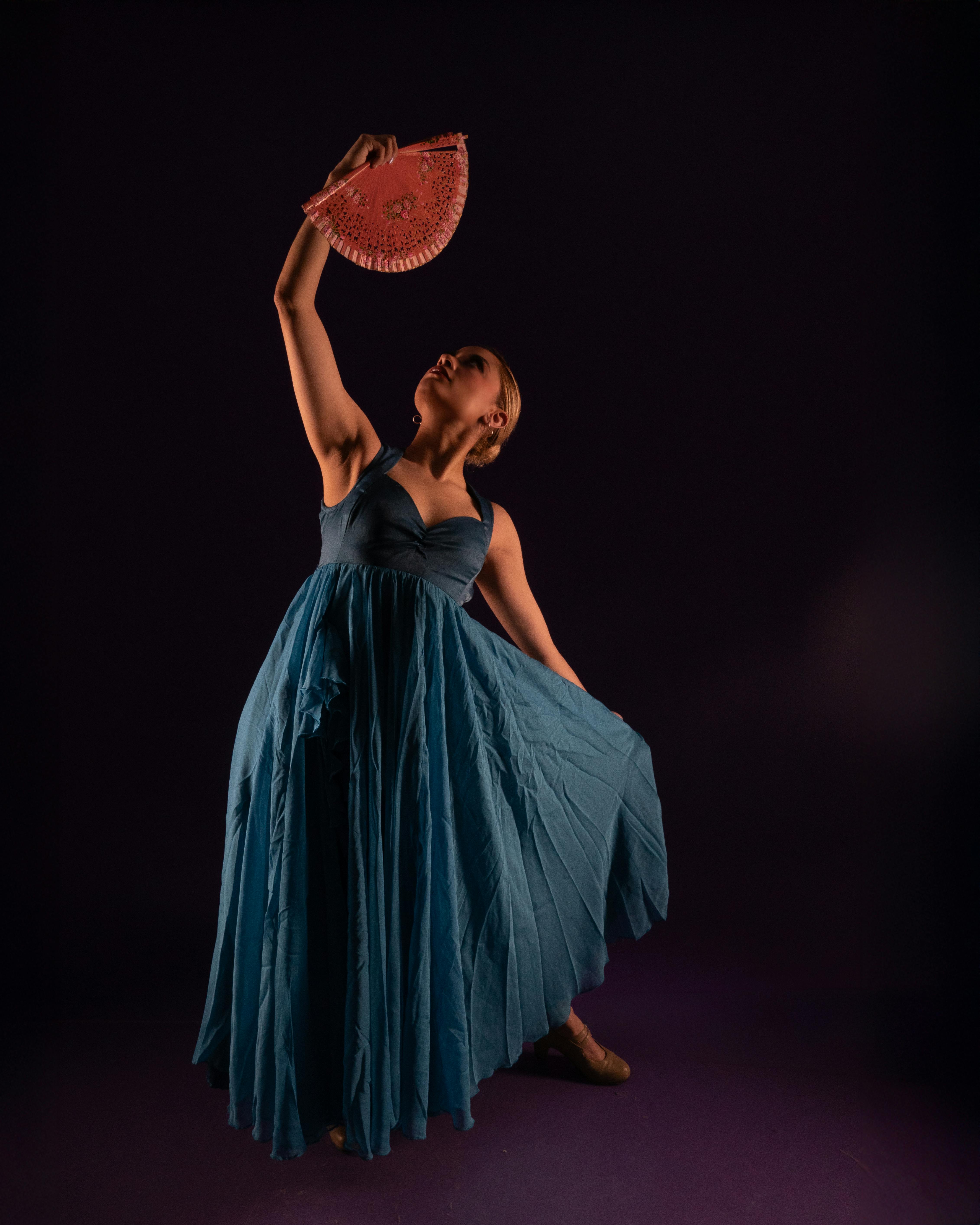 Elegant Flamenco Dancer with Fan Pose · Free Stock Photo