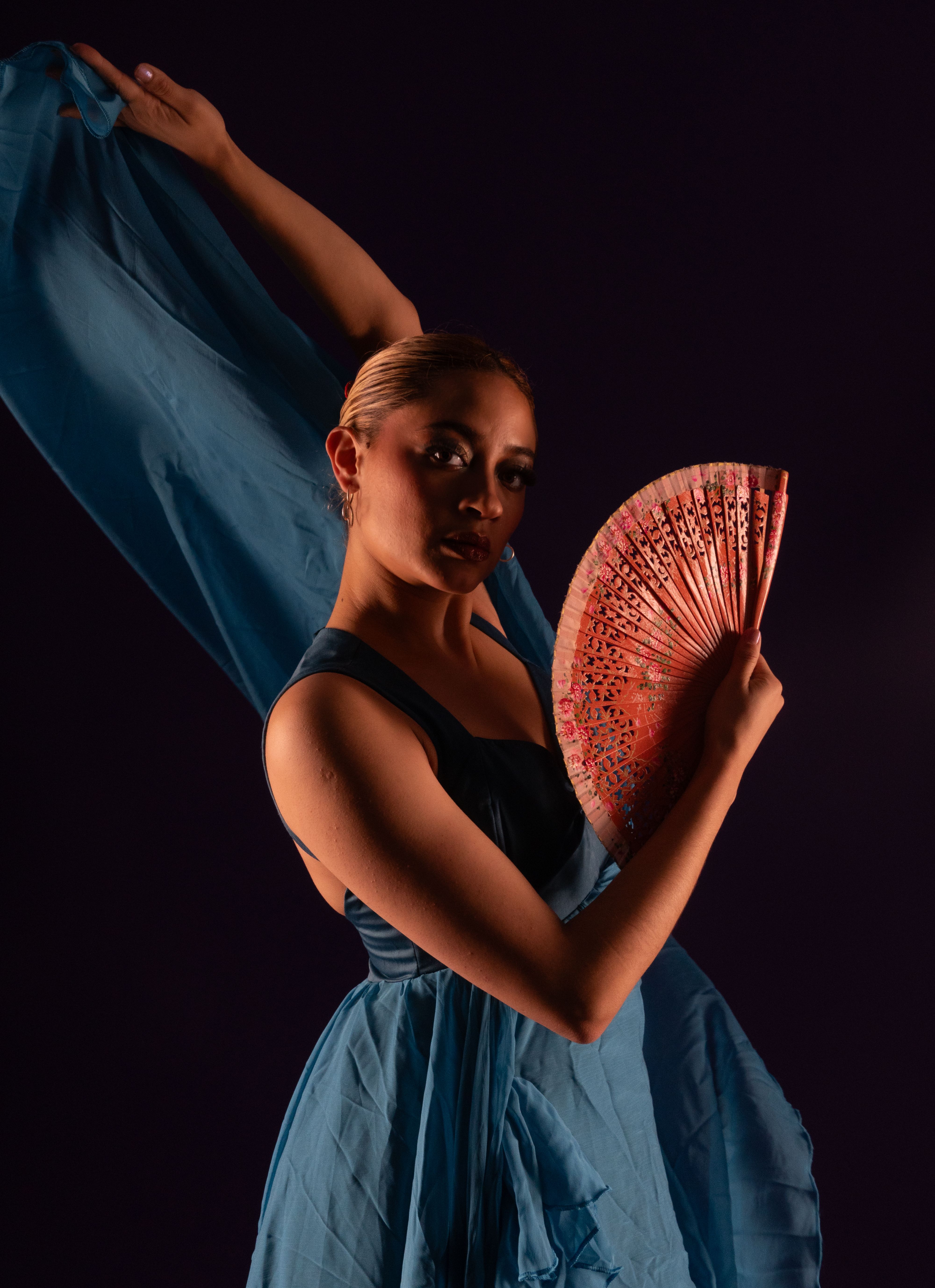 Elegant Flamenco Dancer with Fan in Studio · Free Stock Photo