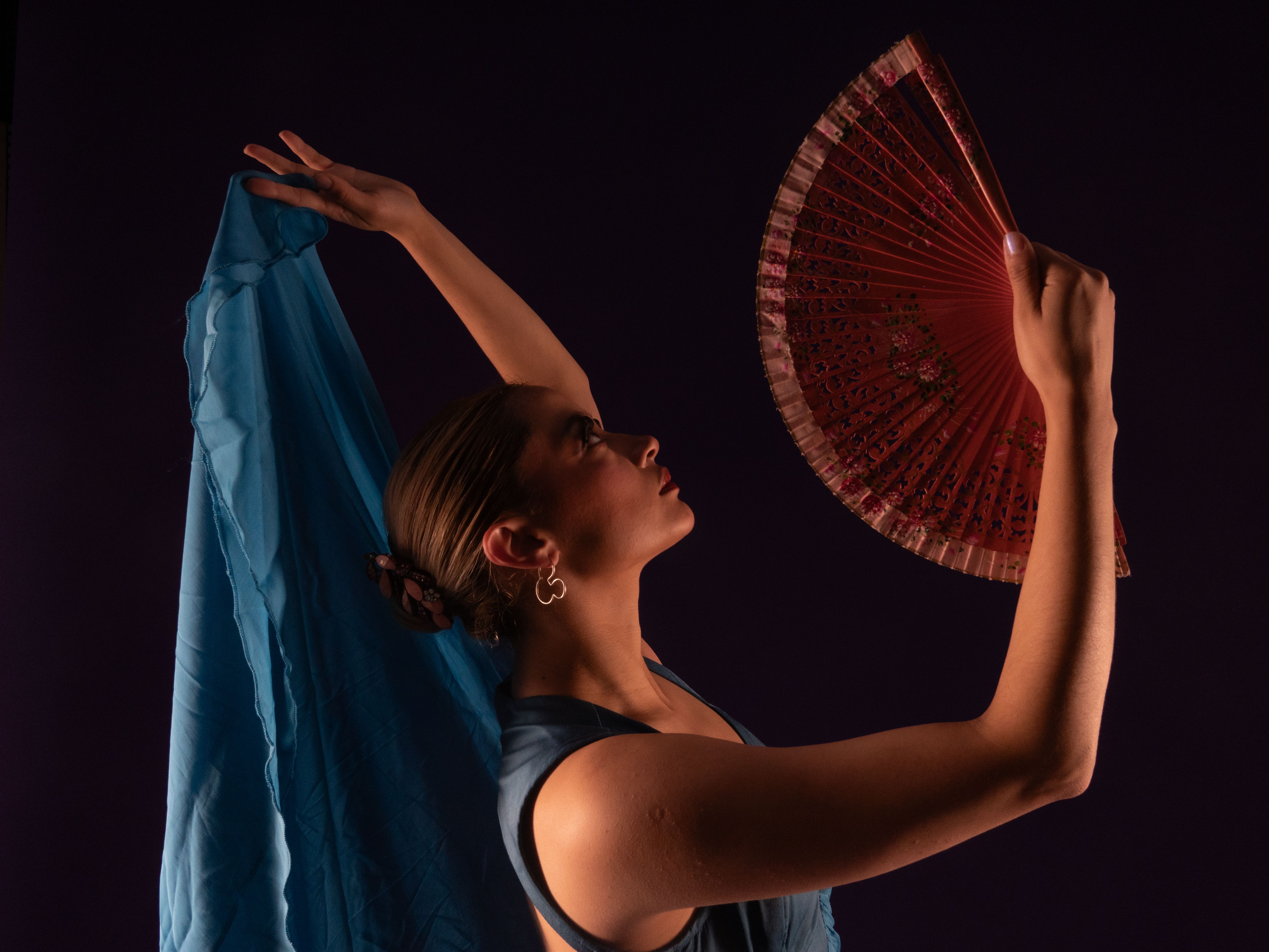 Elegant Flamenco Dancer with Fan Performing · Free Stock Photo