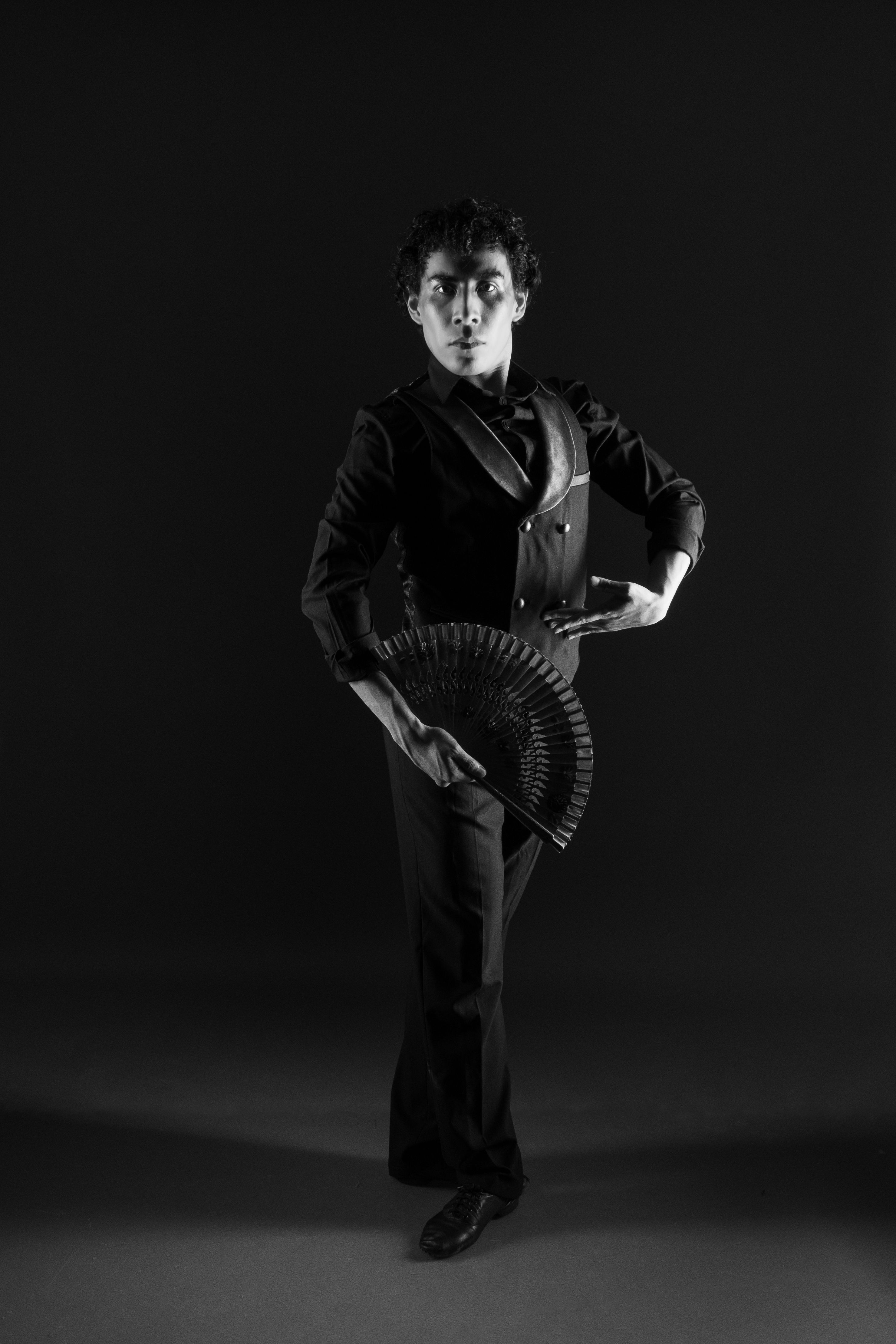 Elegant Male Dancer with Fan in Black and White · Free Stock Photo