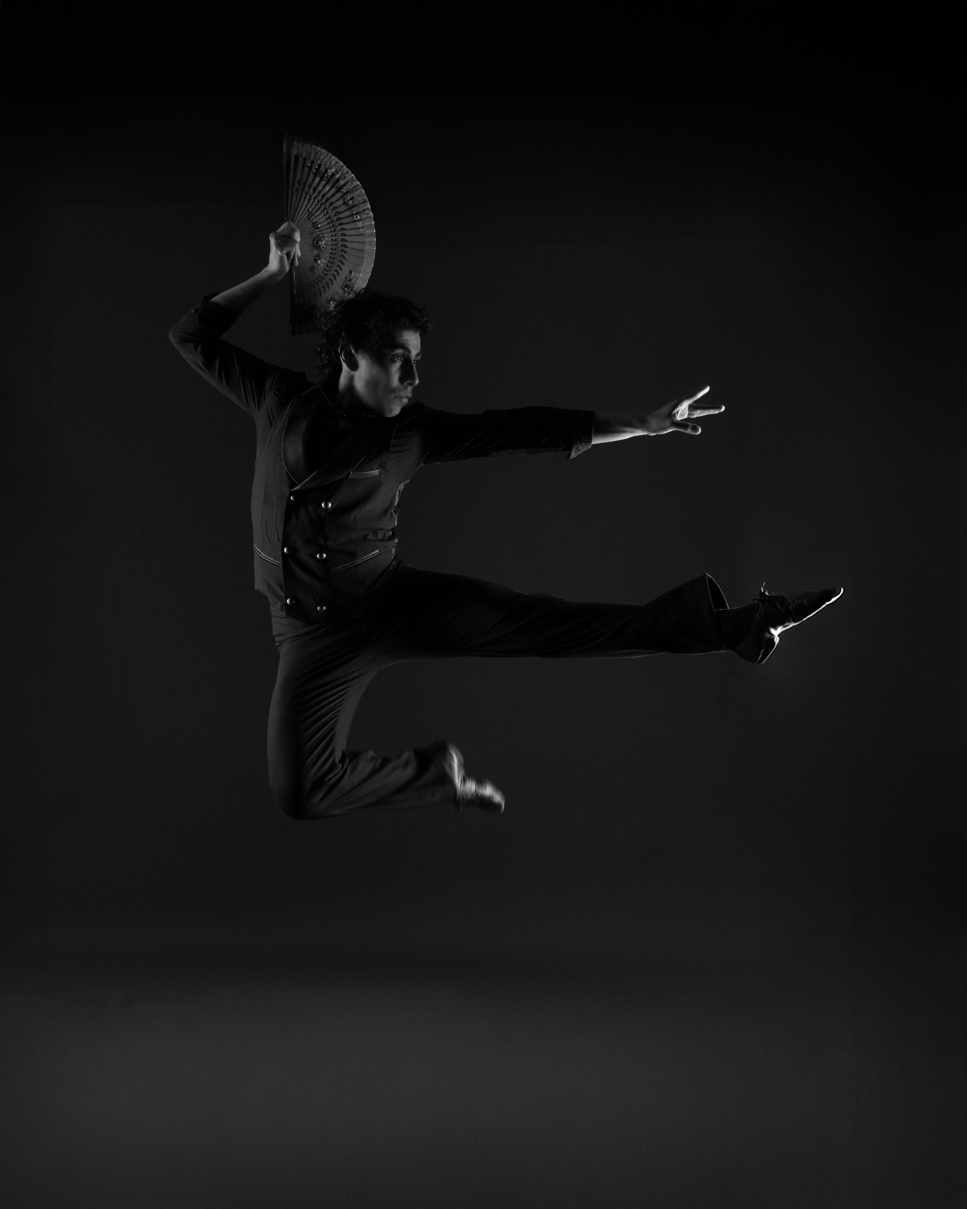 Dynamic Male Dancer in Motion with Black Backdrop · Free Stock Photo
