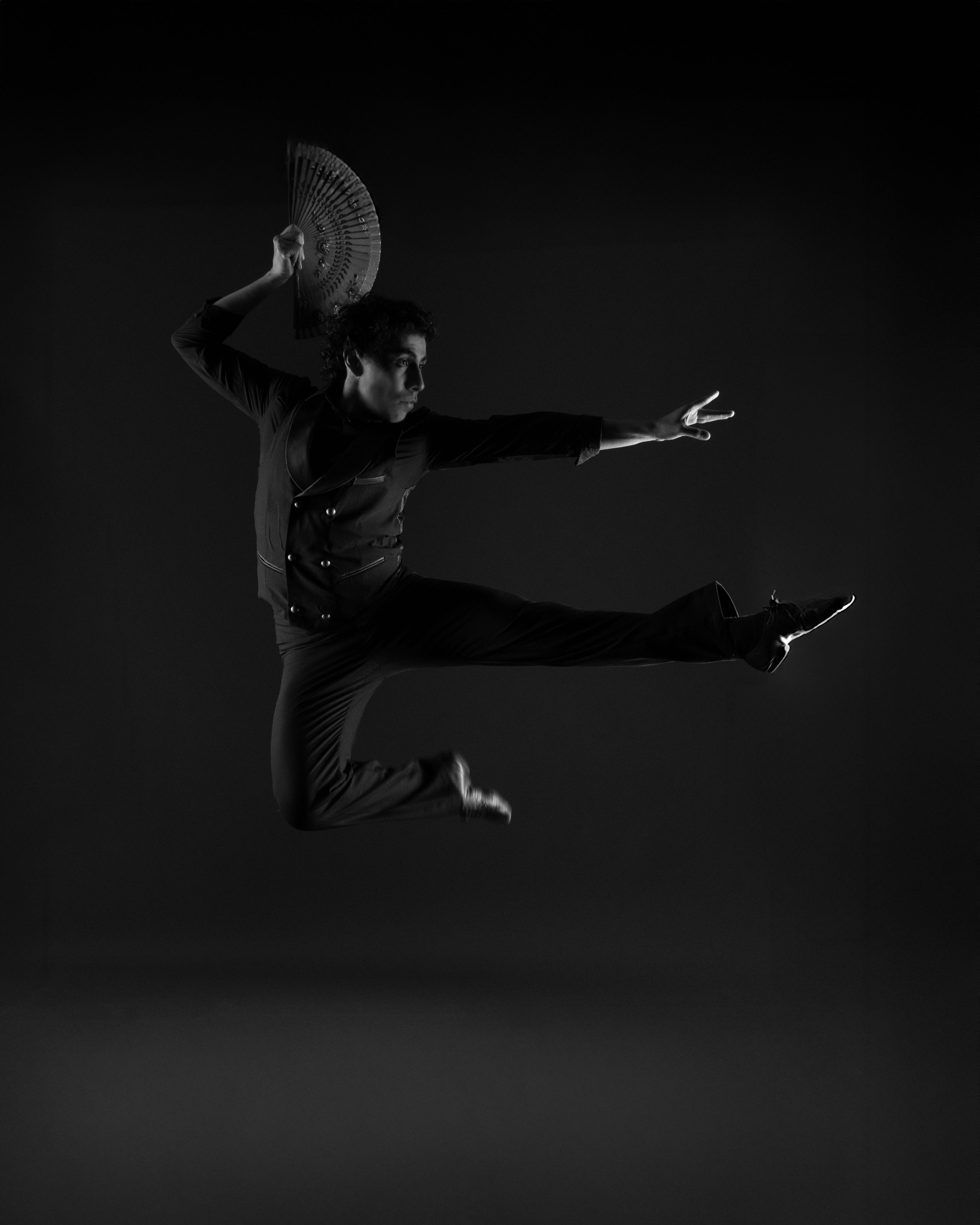 Dynamic Male Dancer in Motion with Black Backdrop · Free Stock Photo