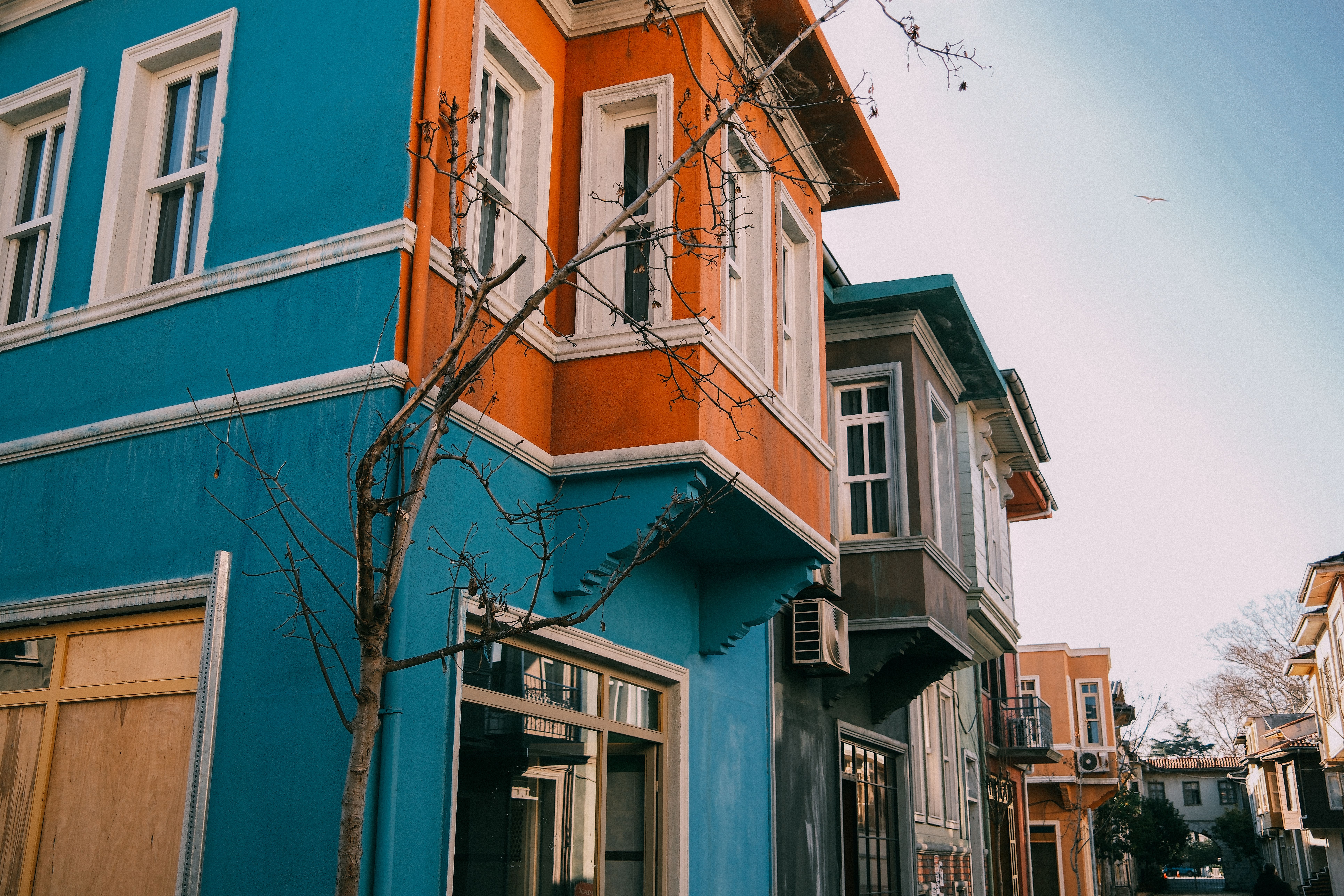 Colorful Street Architecture in Sunlit Urban Scene · Free Stock Photo