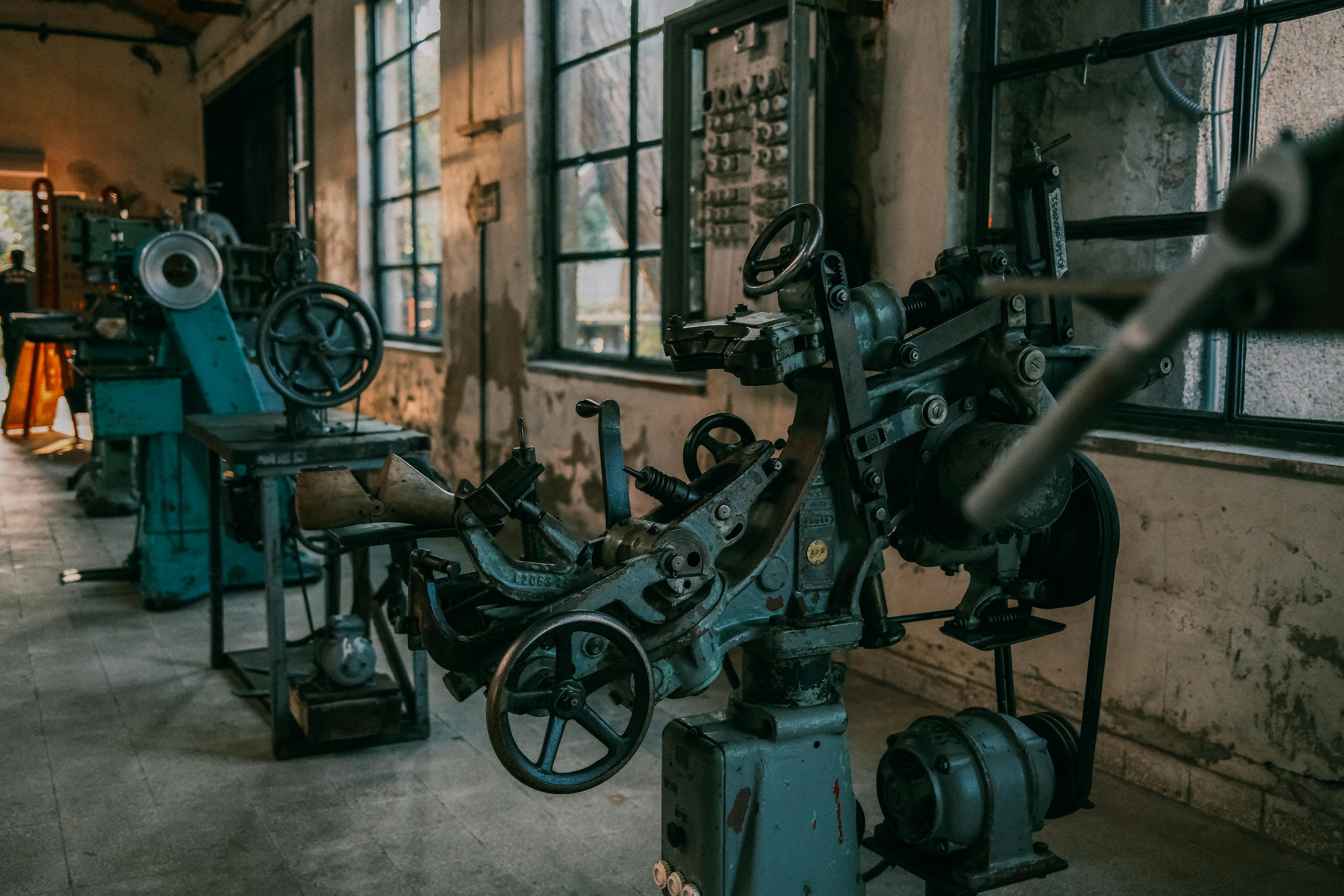 Vintage Industrial Machines in Abandoned Workshop · Free Stock Photo
