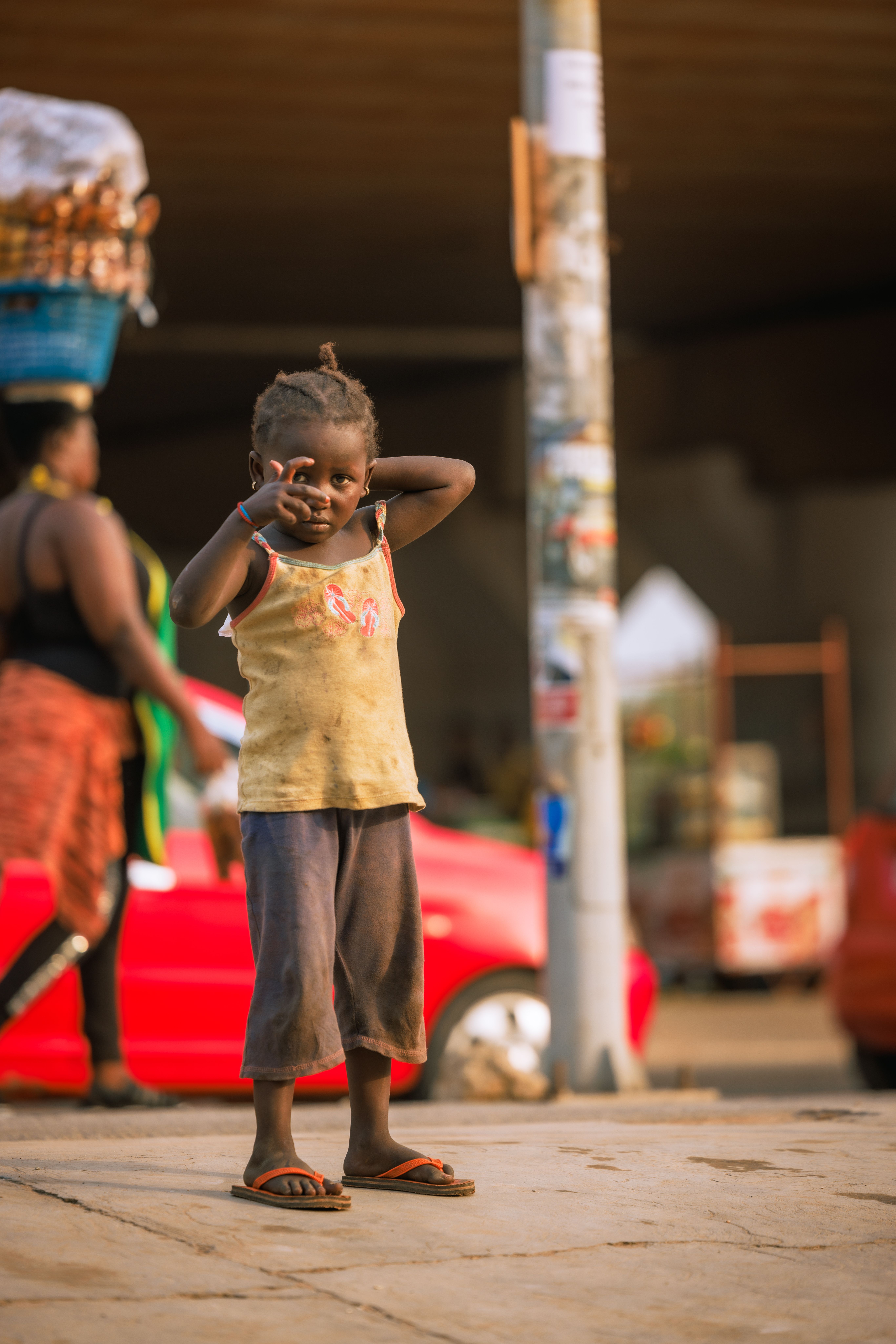 Young Child on a Busy Street Corner · Free Stock Photo