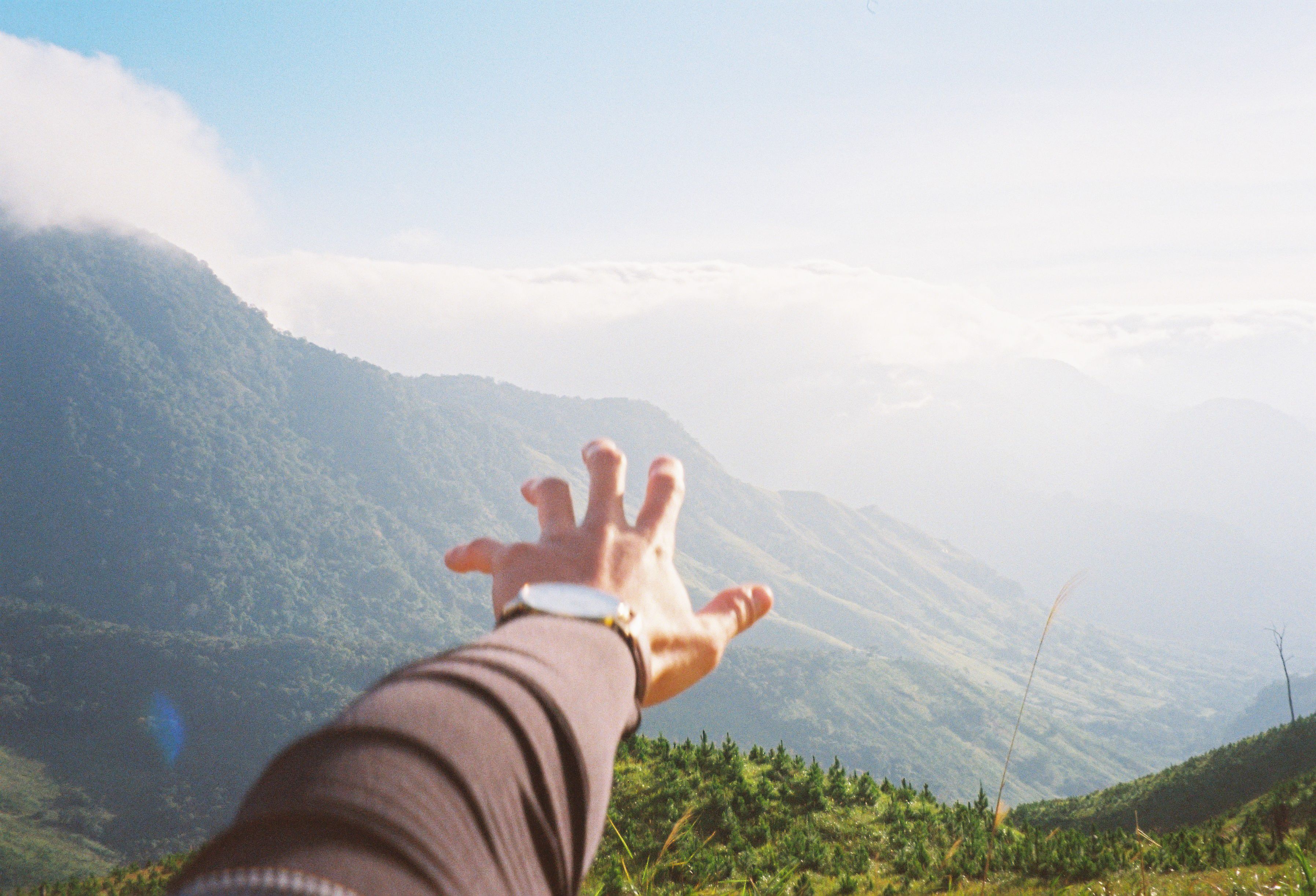Reaching Out Towards Majestic Mountain Landscape · Free Stock Photo