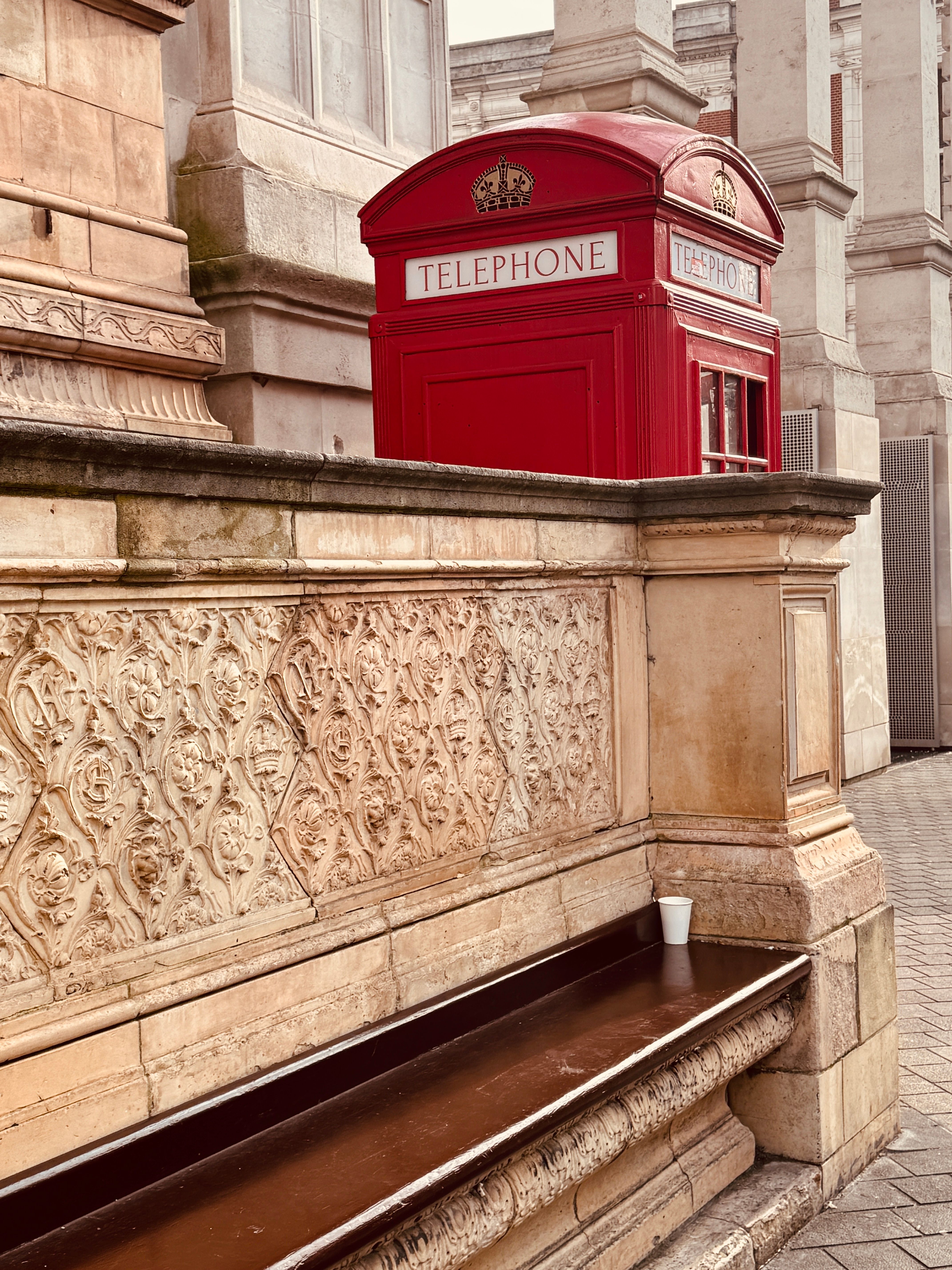 Iconic Red Telephone Booth in Classic Setting · Free Stock Photo