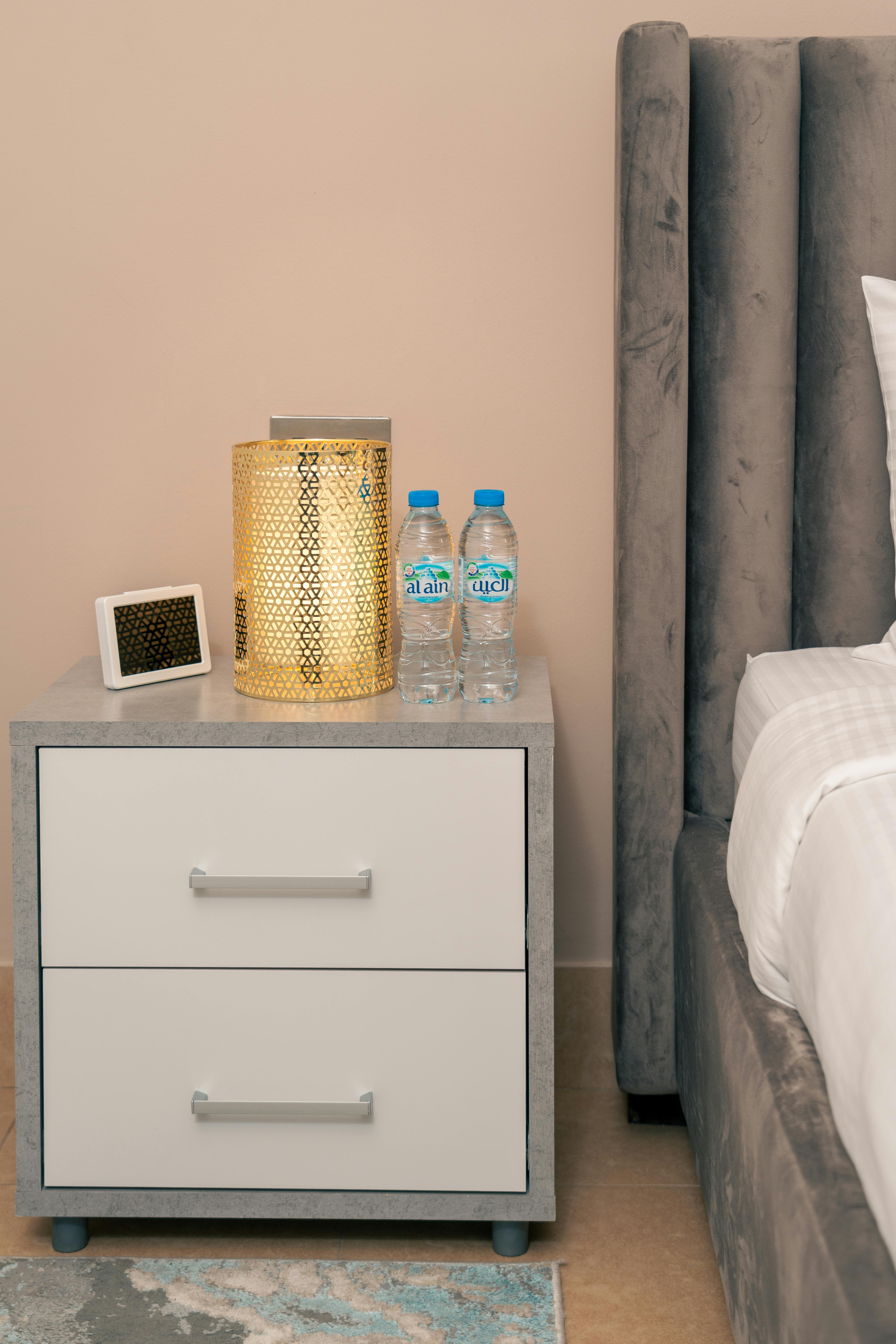 Elegant Nightstand with Lamp and Water Bottles in Dubai Hotel · Free ...