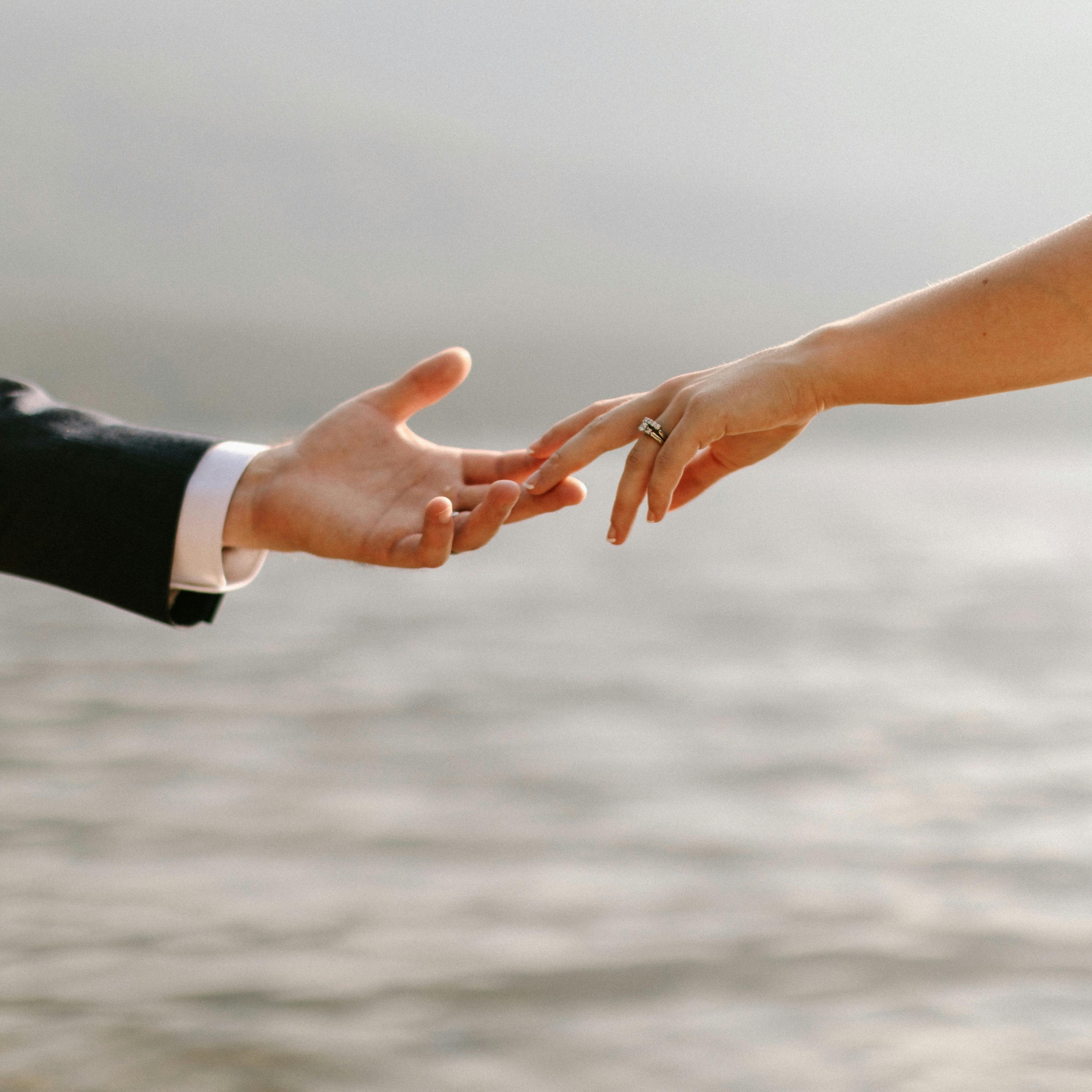 Romantic Couples Hands with Wedding Rings · Free Stock Photo