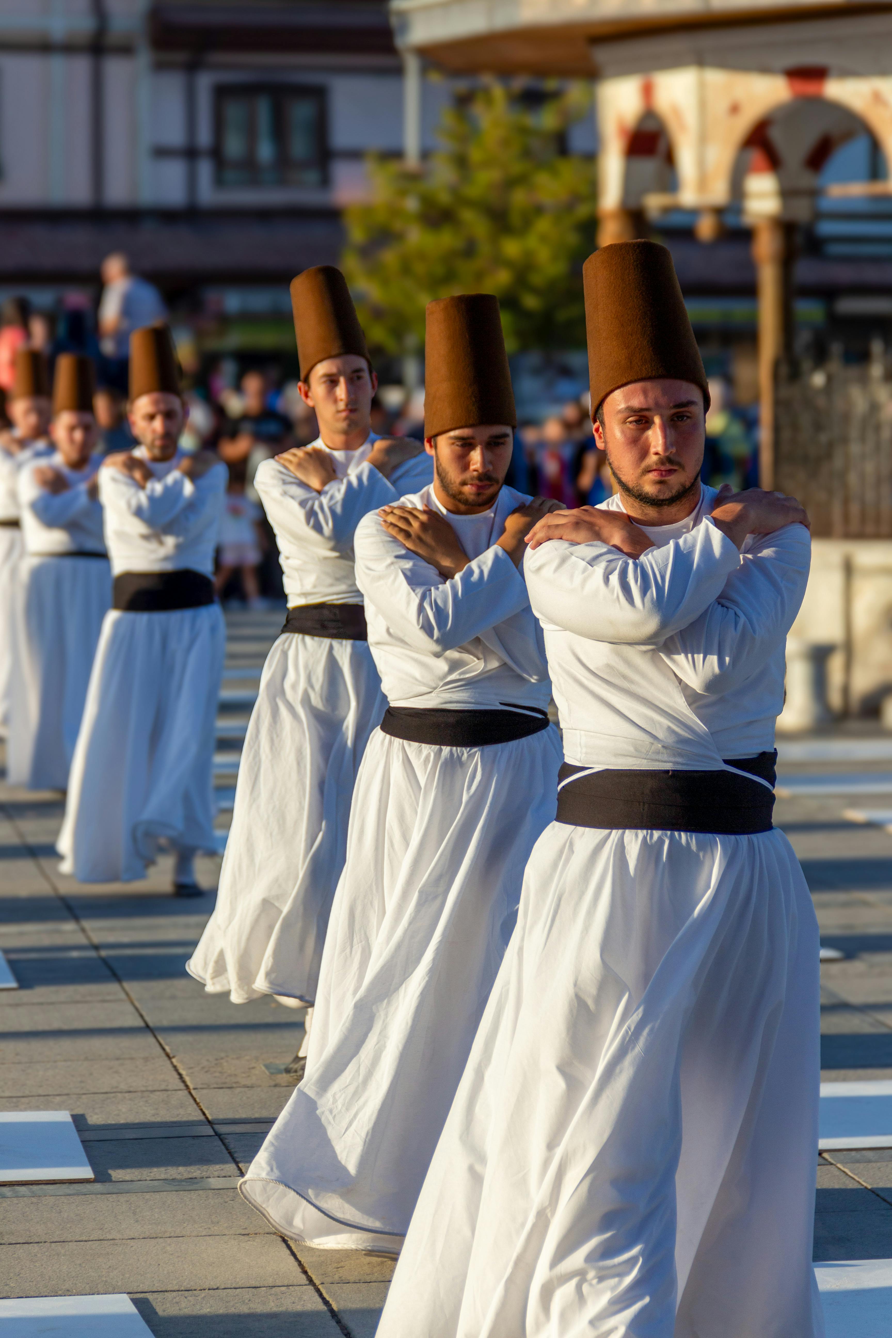 Traditional Sufi Whirling Dervishes in Ceremony · Free Stock Photo