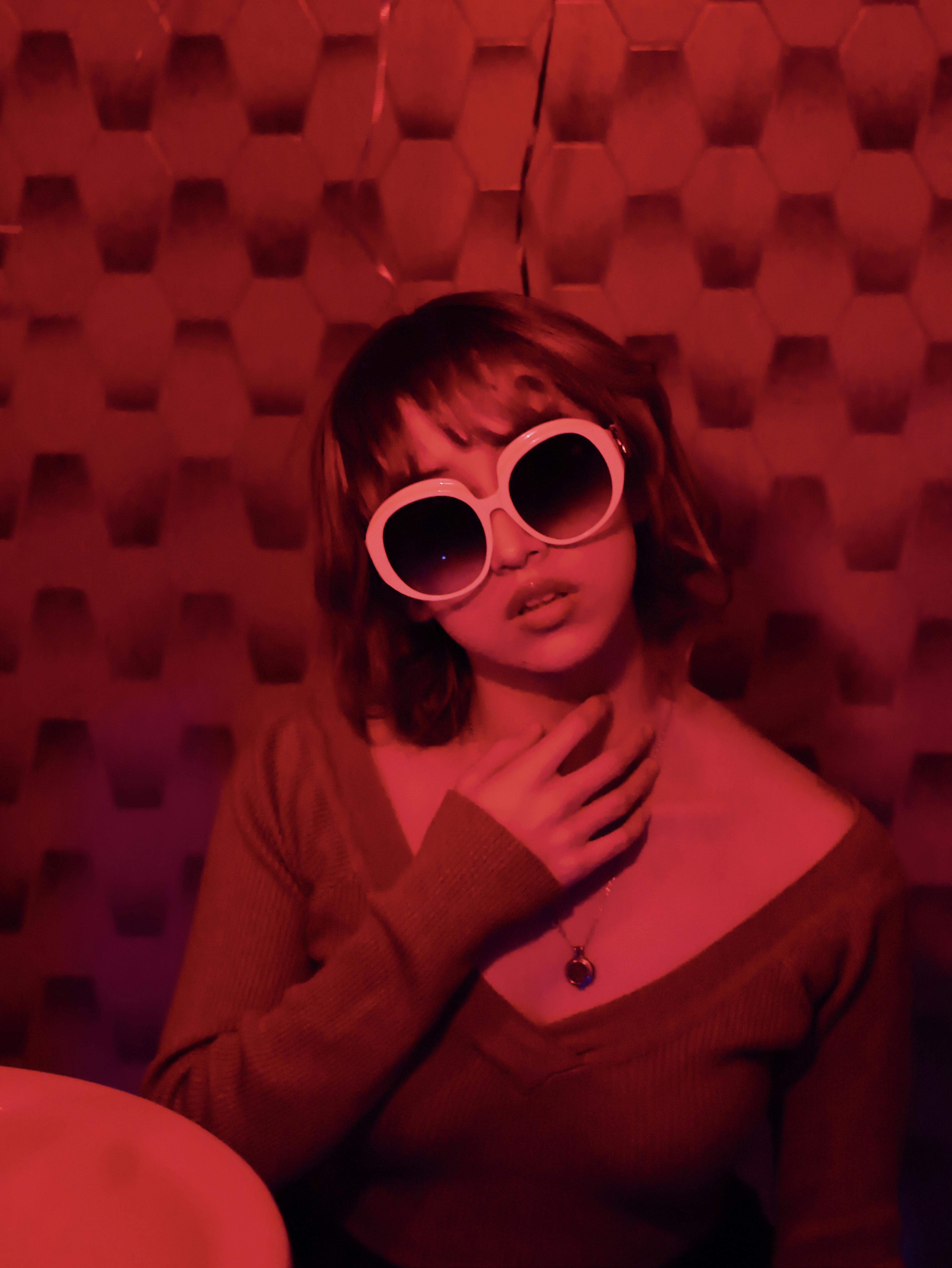 Fashionable Woman in Red Ambient Lighting · Free Stock Photo