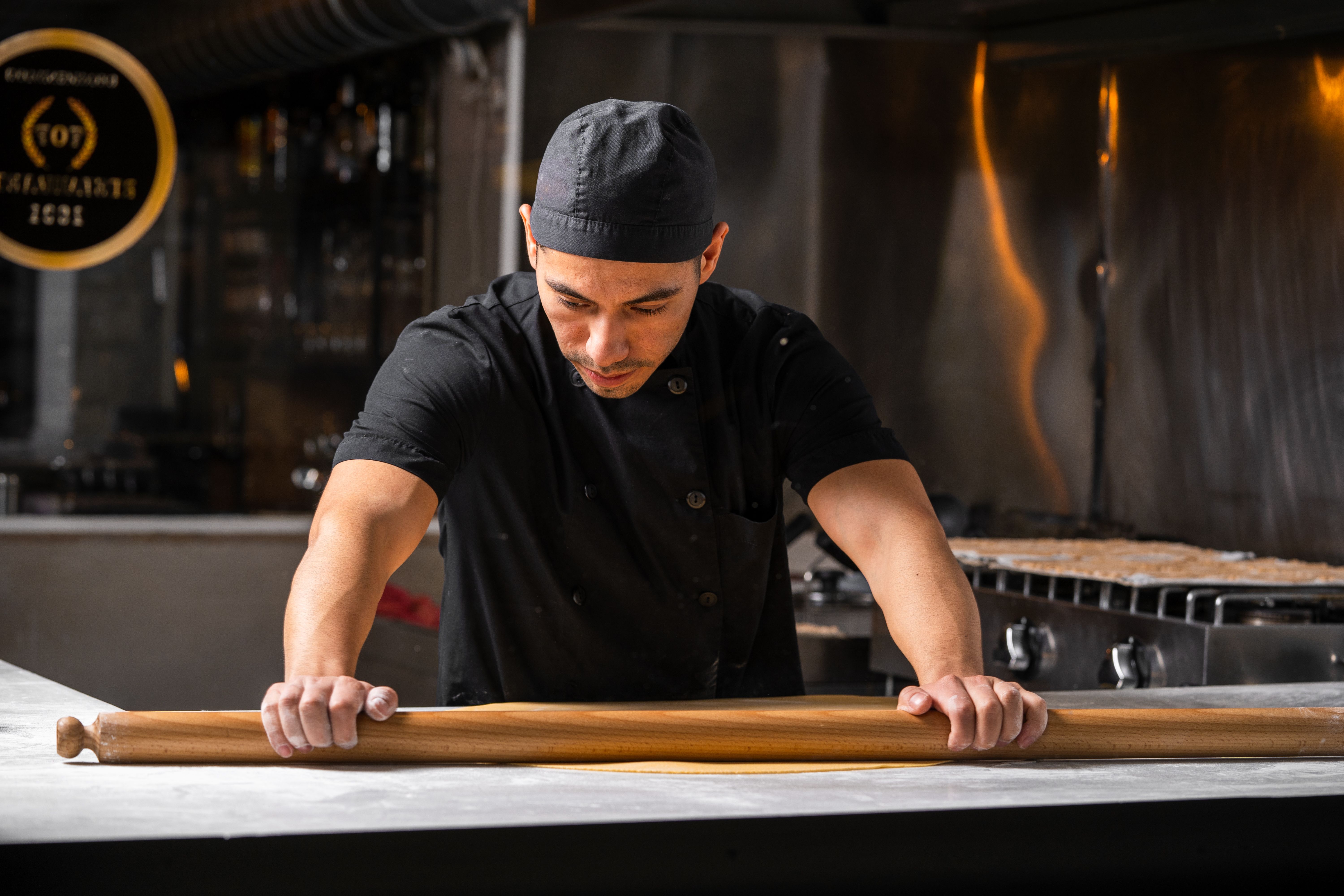 Chef Rolling Dough in Professional Kitchen · Free Stock Photo