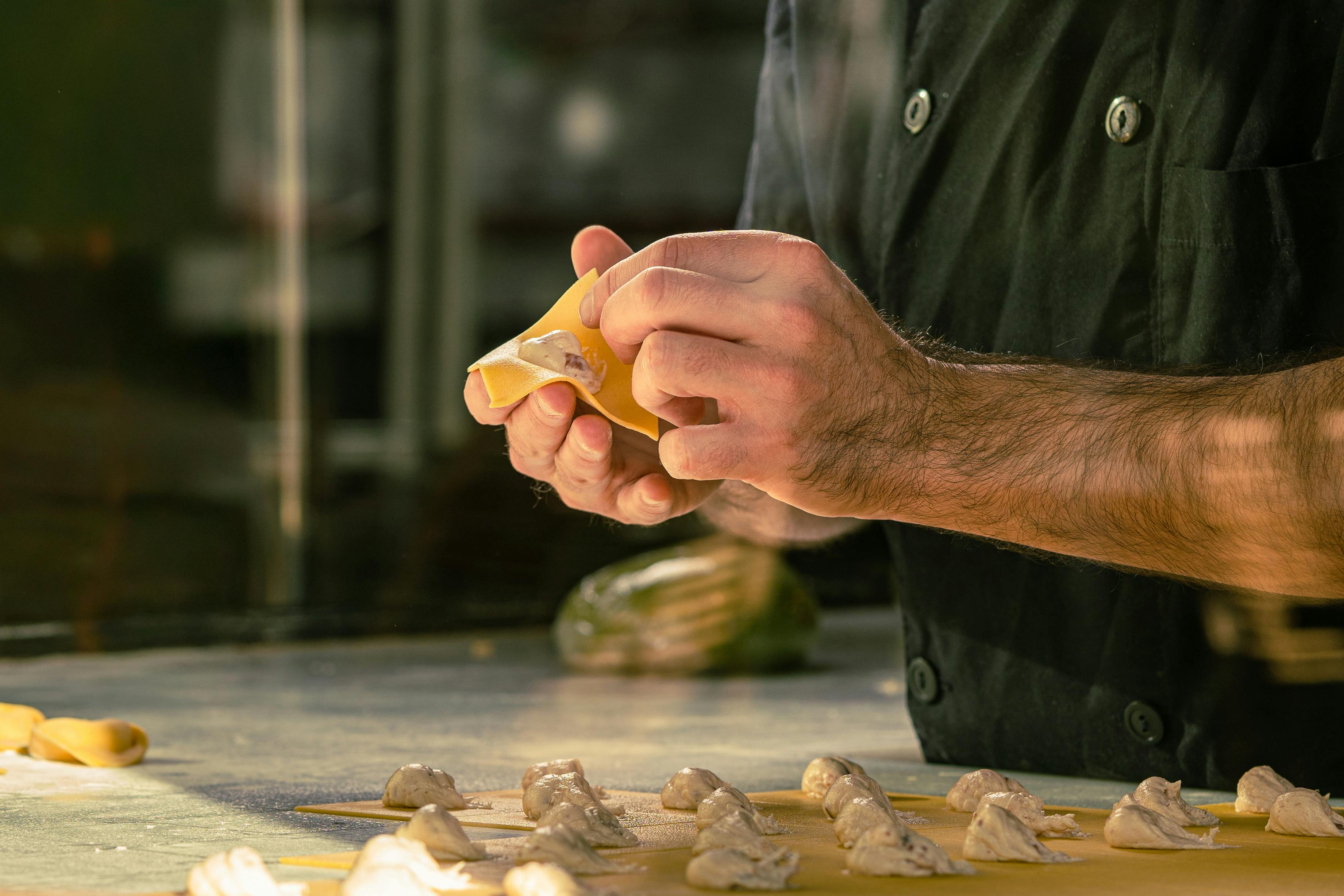 Chef Preparing Vegetable Dish on Tree Slab · Free Stock Photo