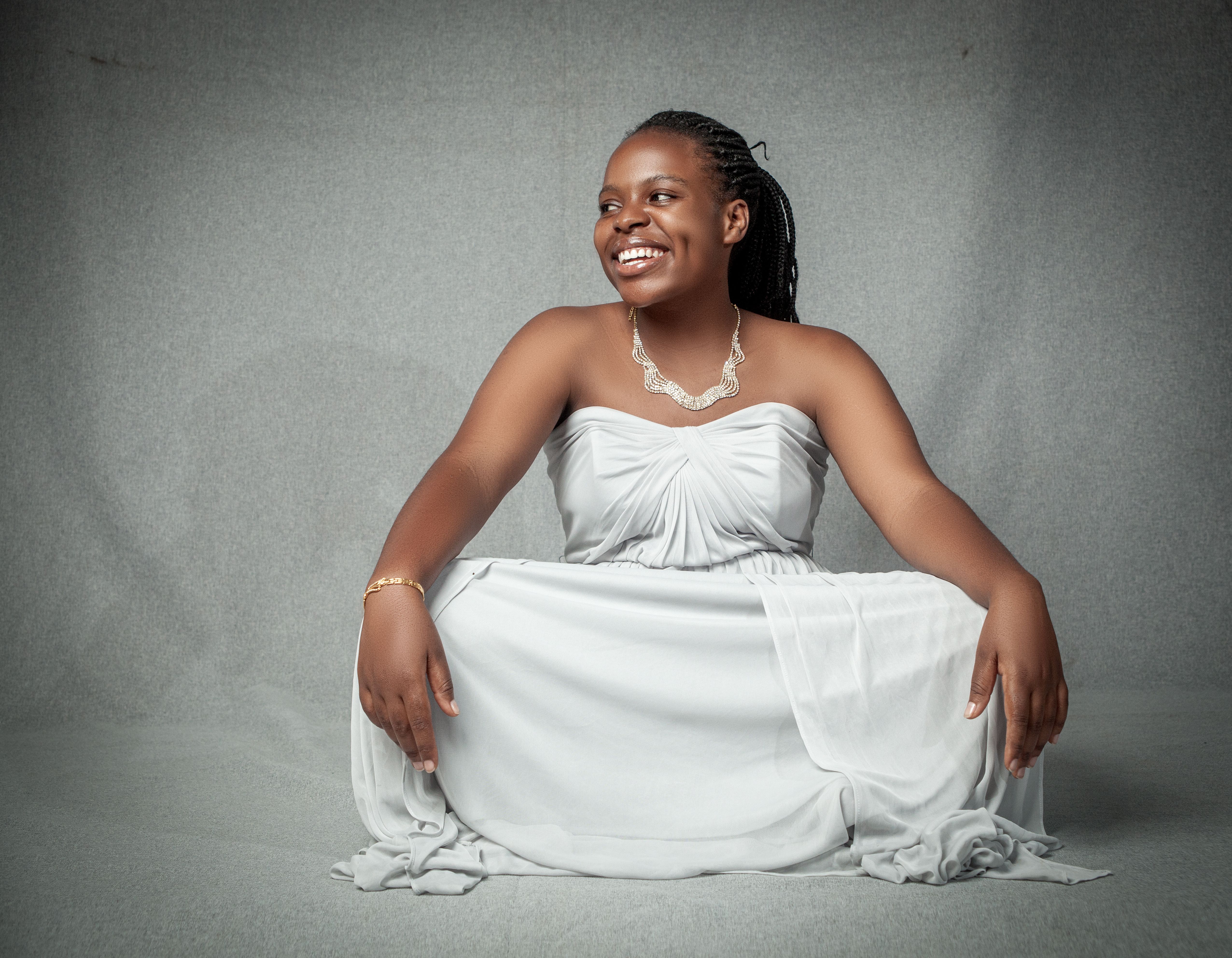 Elegant African Woman Smiling in Portrait · Free Stock Photo
